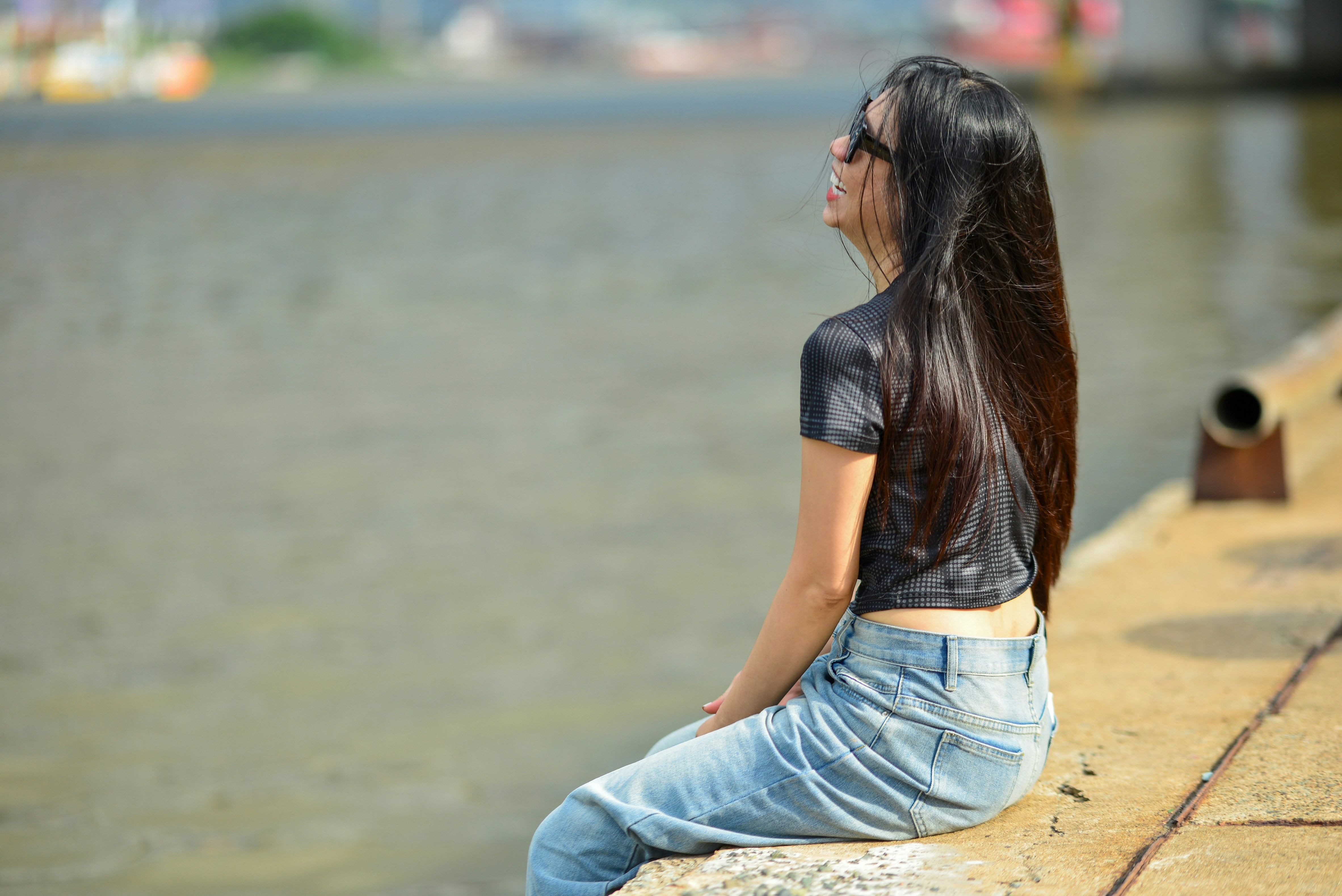Sunlit Shoreline Portrait: A Quiet Moment by the Waterfront