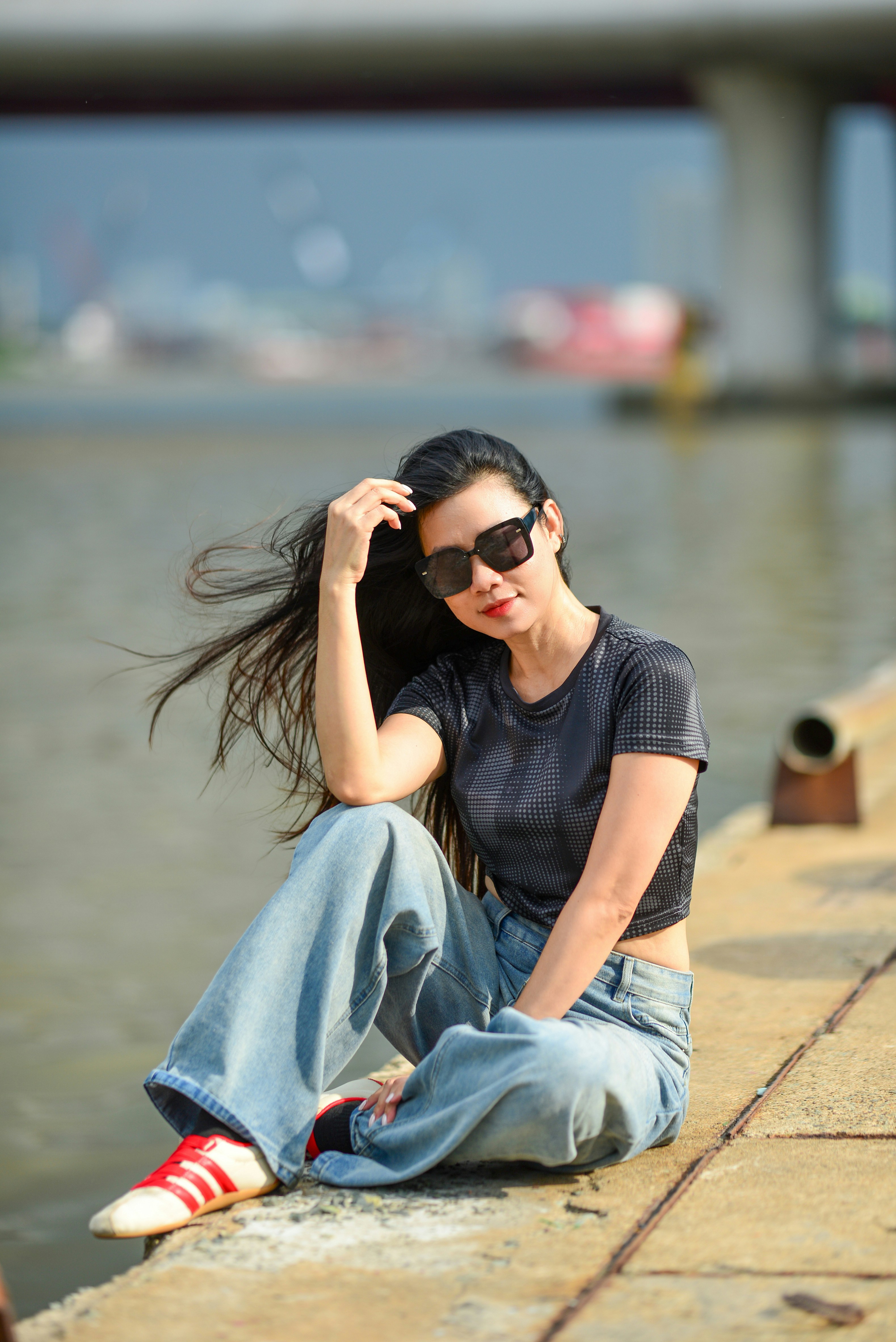 Sunlit Harbor Portrait: A Relaxed Moment by the Water