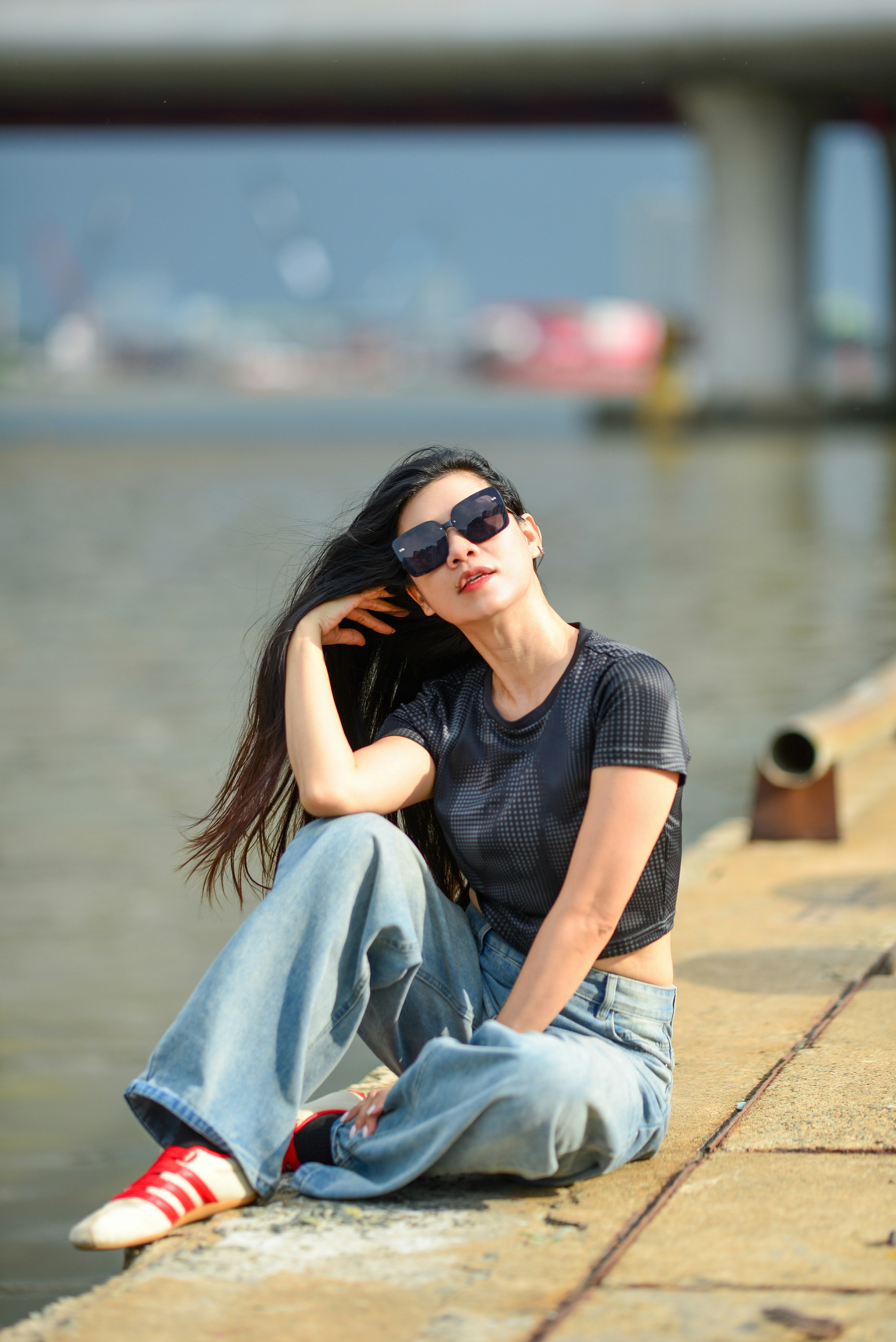 Jet-Set Quiet: A Sunglassed Moment by the Docks