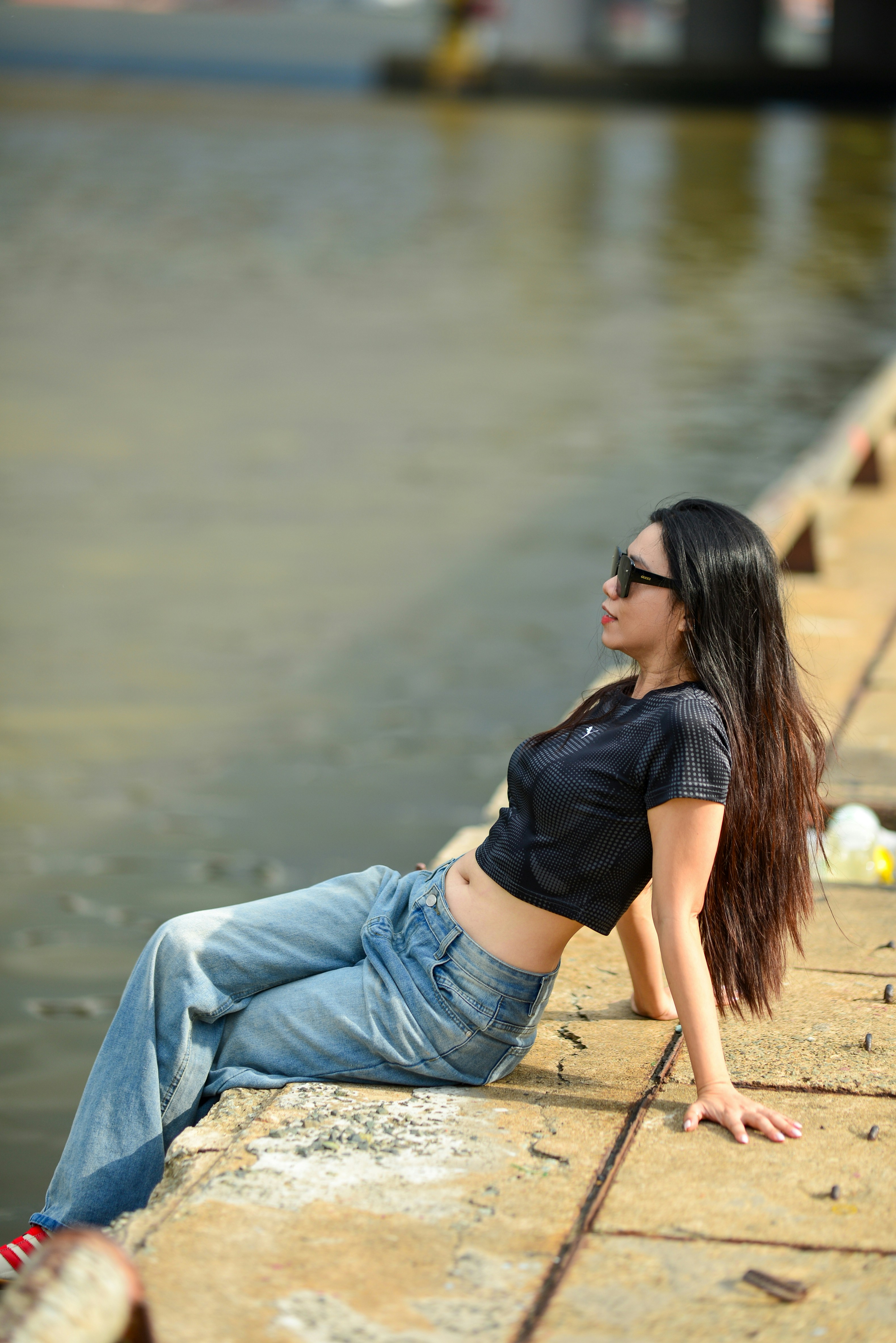 Sunlit Edge: Relaxed Portrait by the Pier