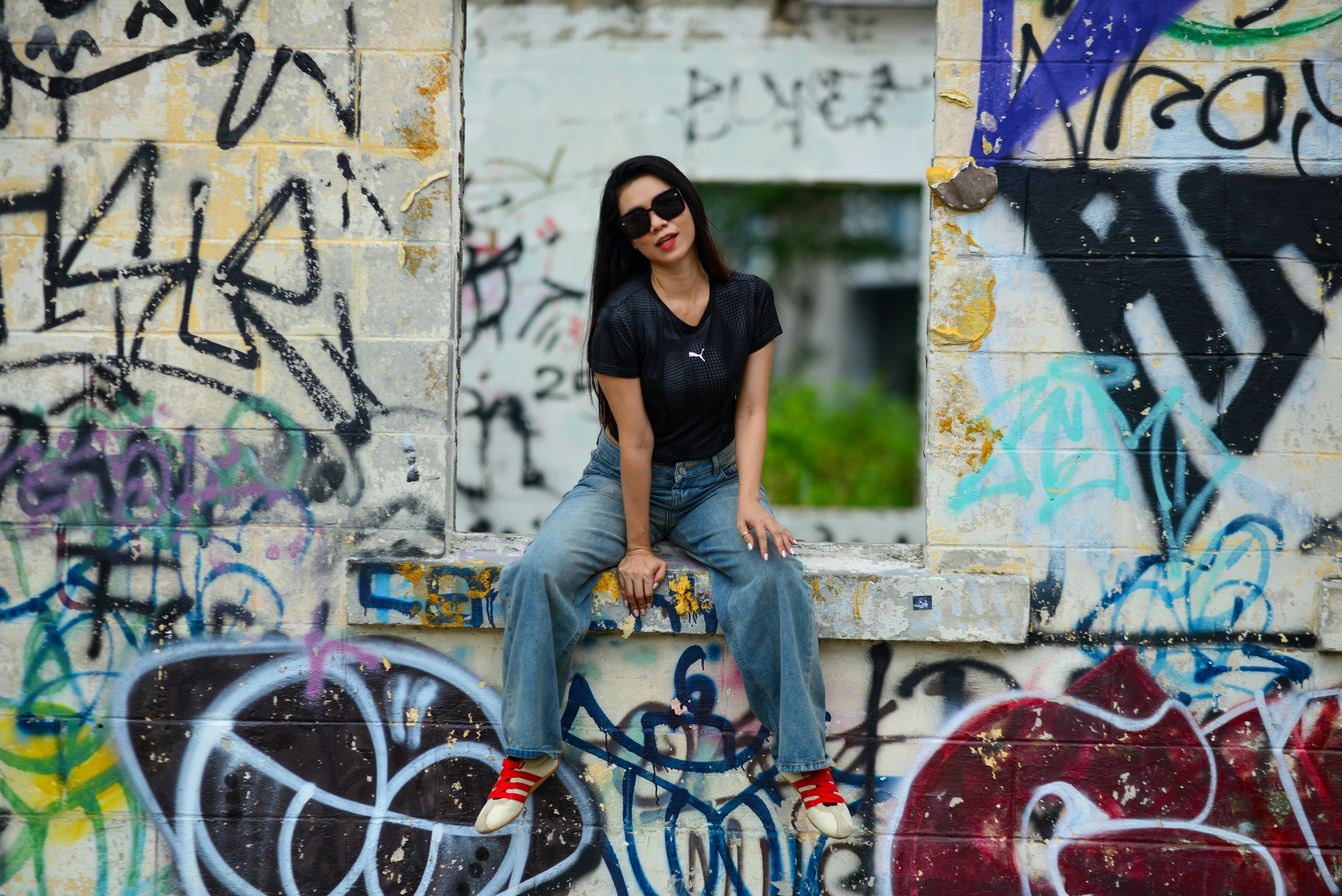 Graffiti Portals: A Street Portrait on Canvas of Concrete Color