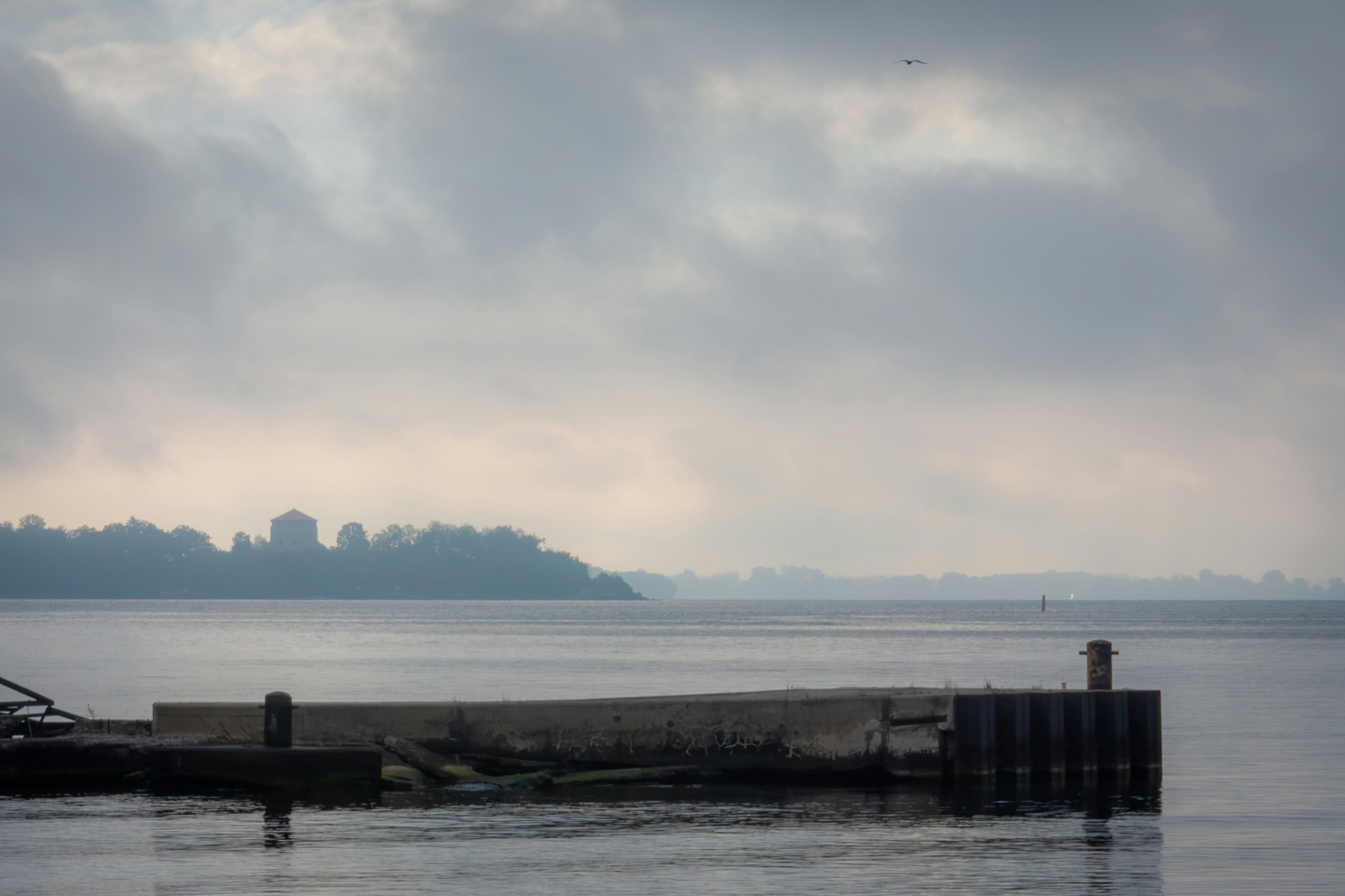 Calm Pier at Dusk: A Silent Waterfront Correction of Distance
