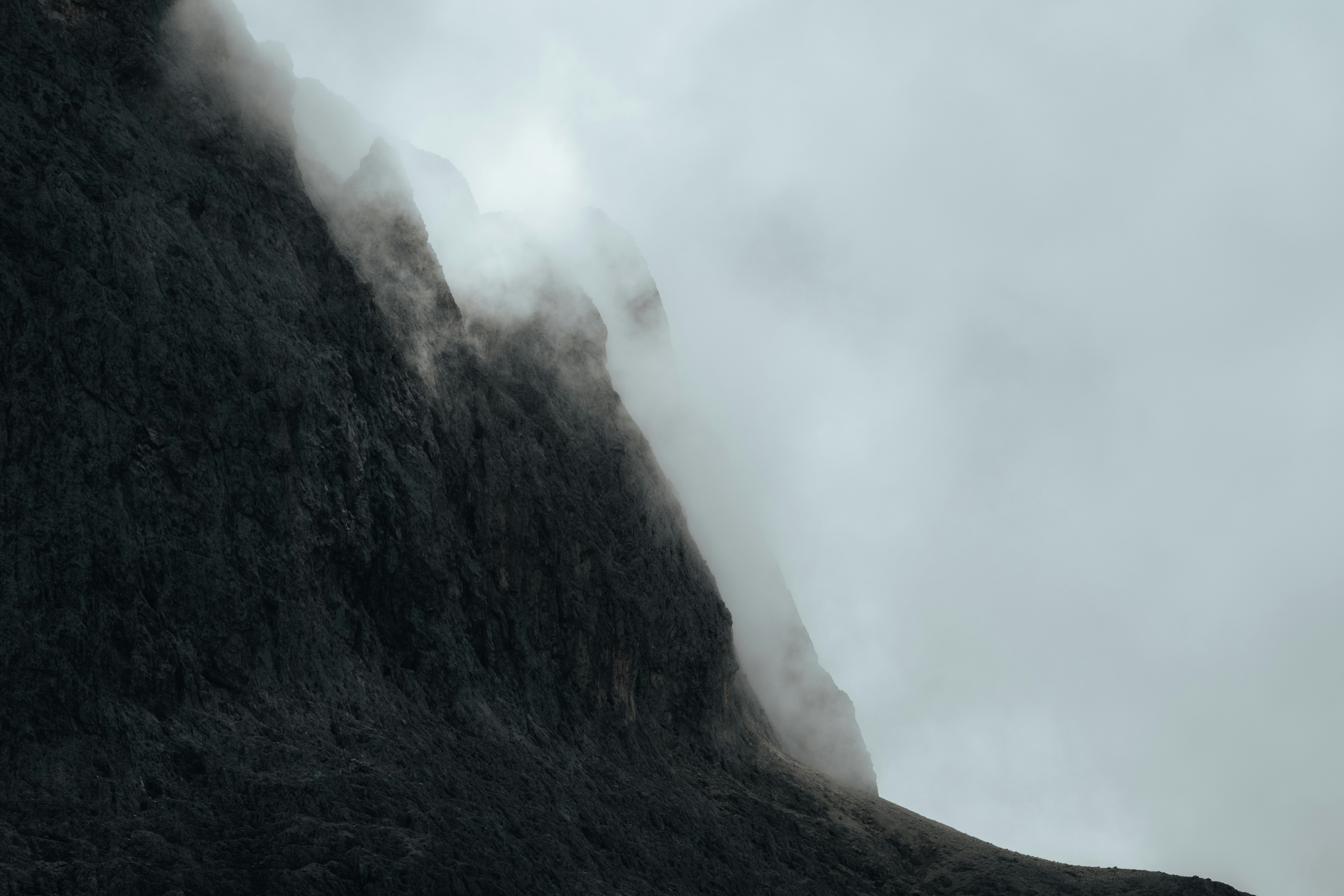 Mist-clad cliff edge swallowing the valley