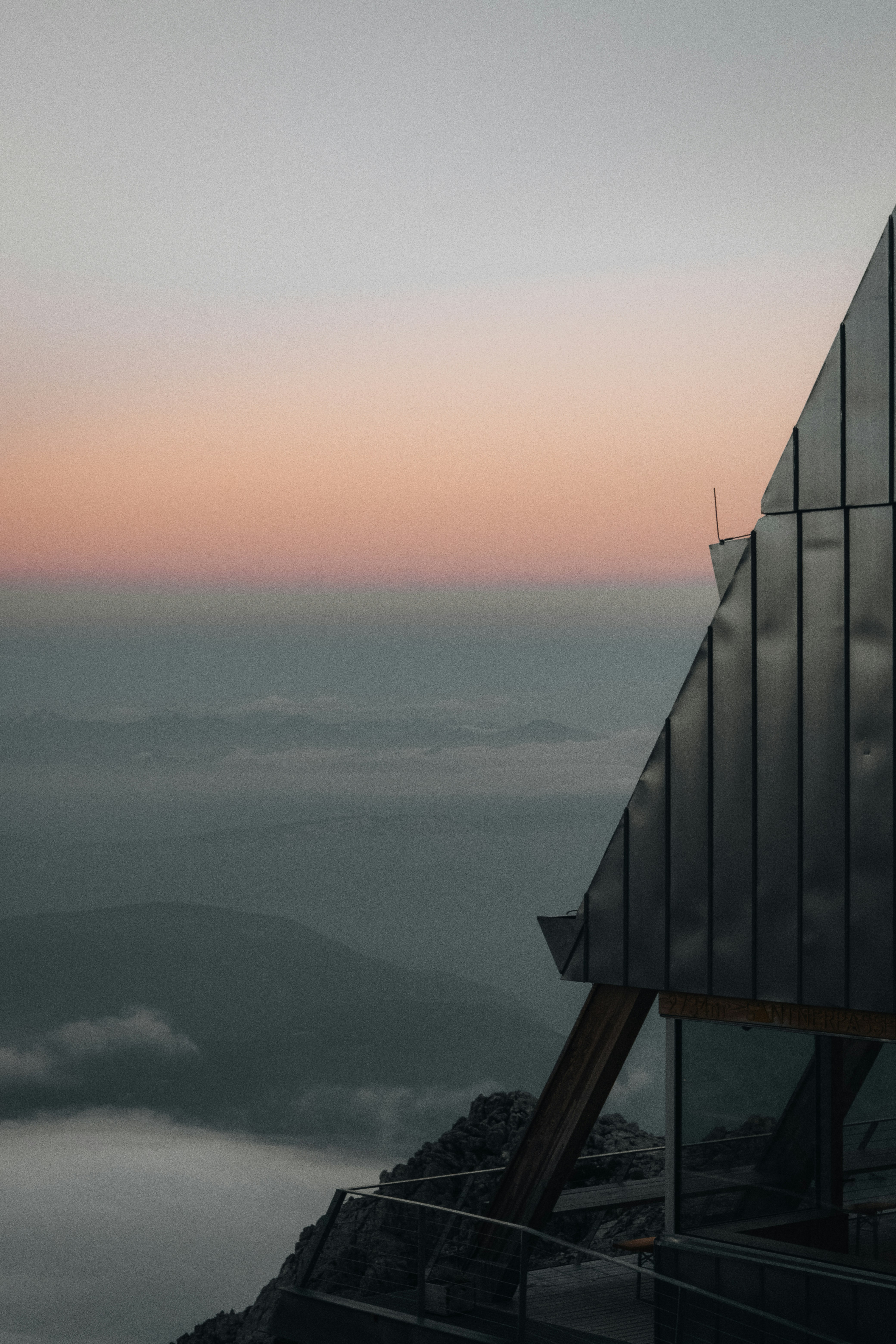 Sunset Over Steel Slopes: The Mountain Observatory Facade