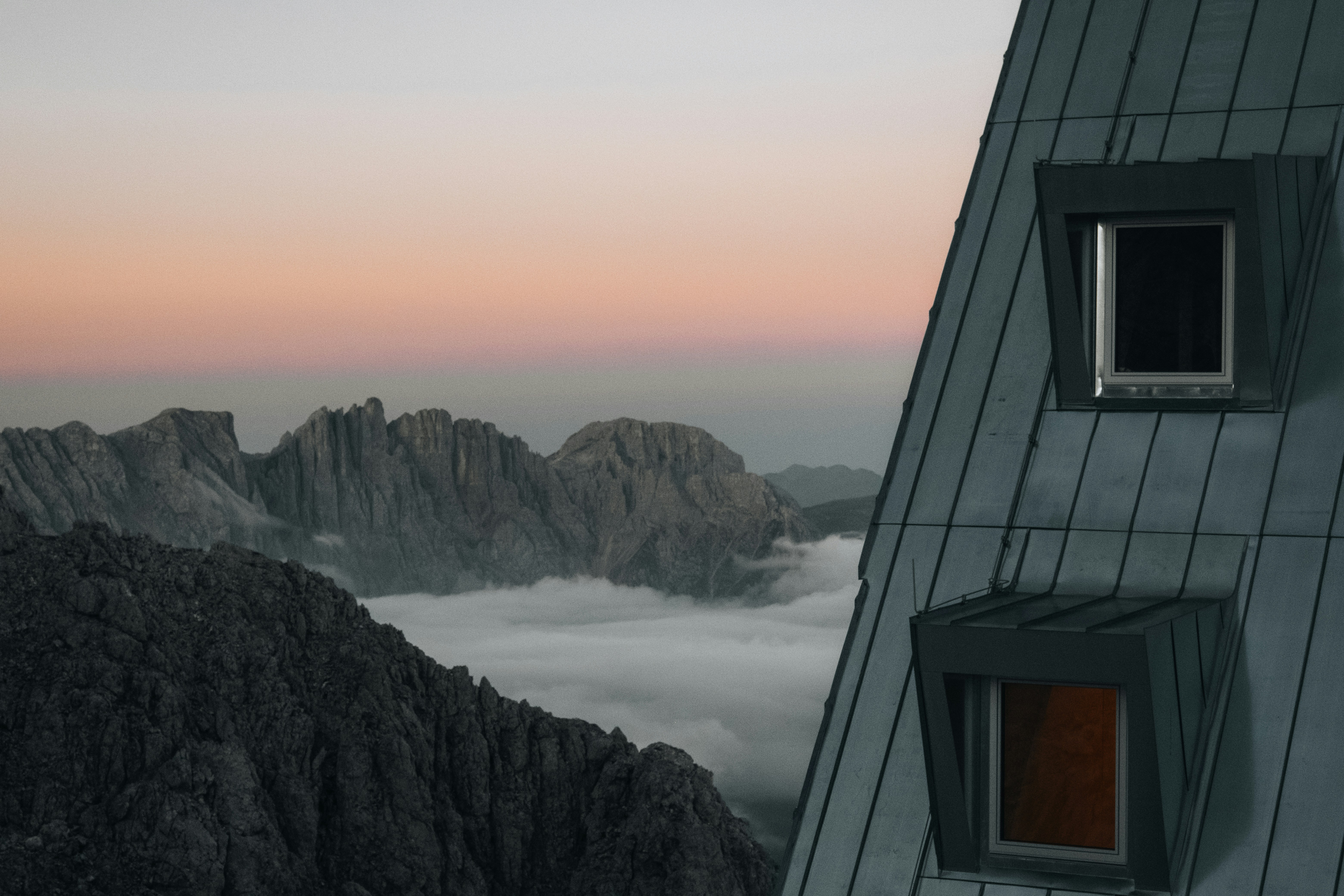 Peak and Pane: A Mountain Chalet Pierces the Clouds