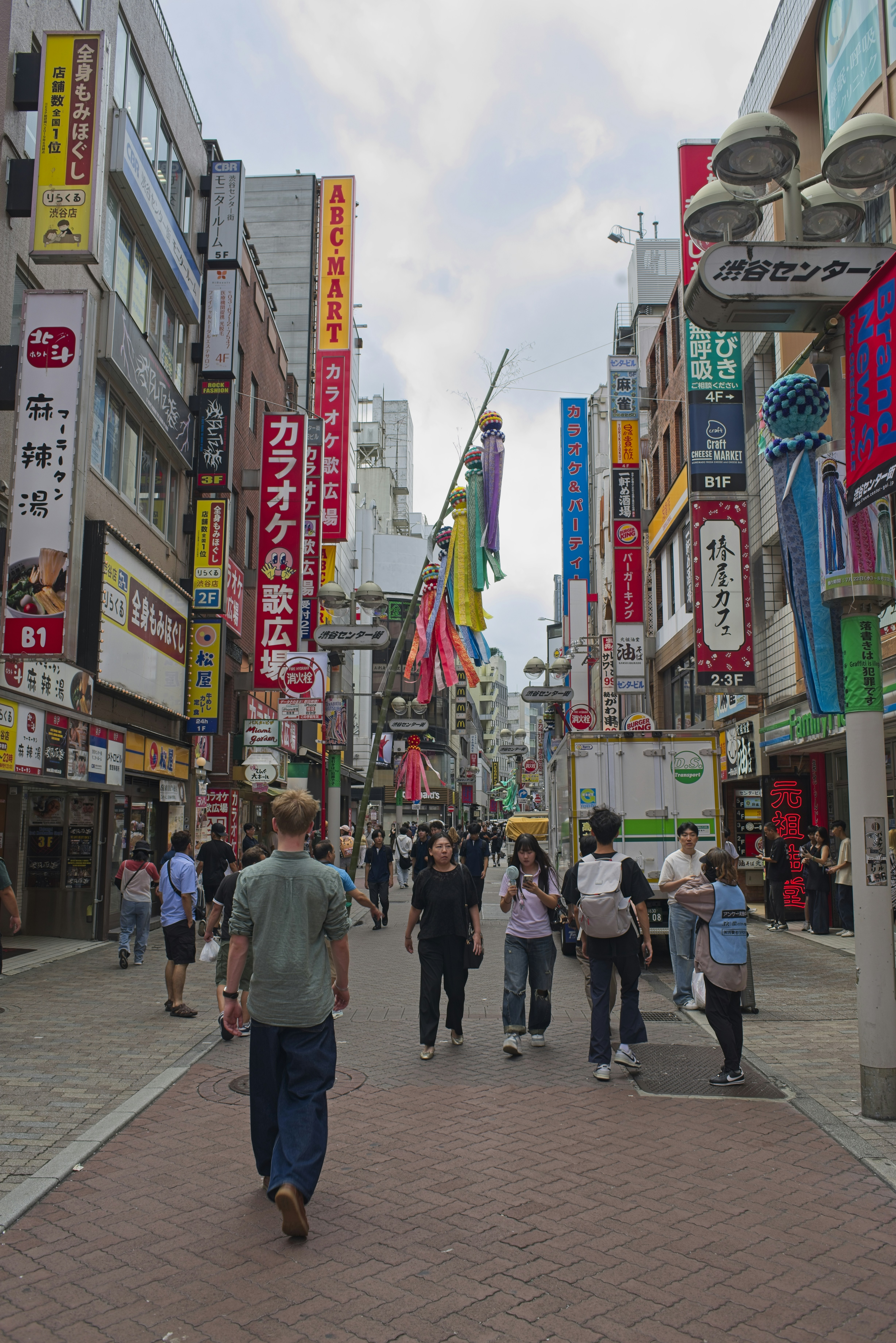 City Pulse: Neon Signs and Pedestrian Flow in a Japanese Arcade