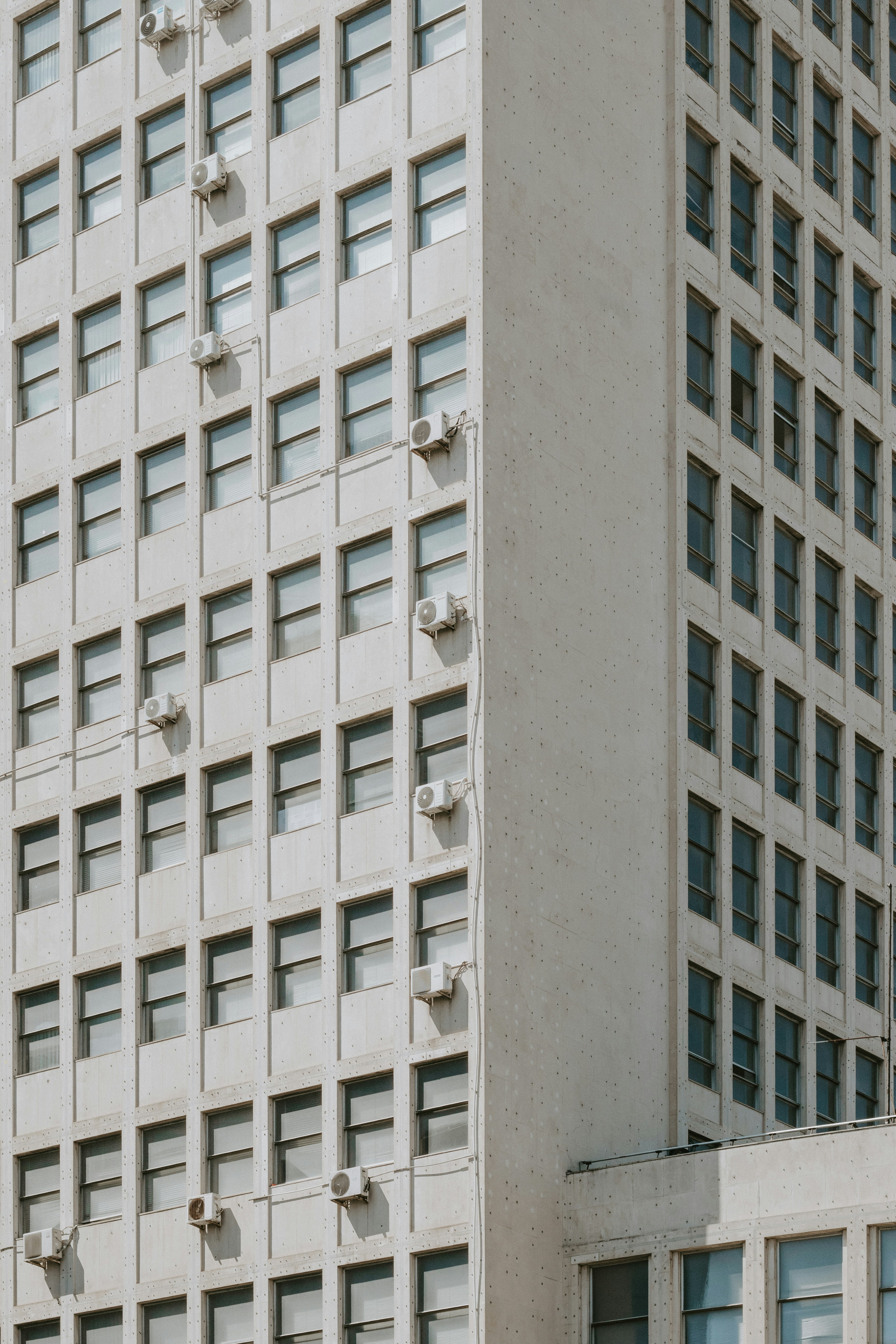 Concrete Grid: A Facade of Repeated Windows and Exterior Units