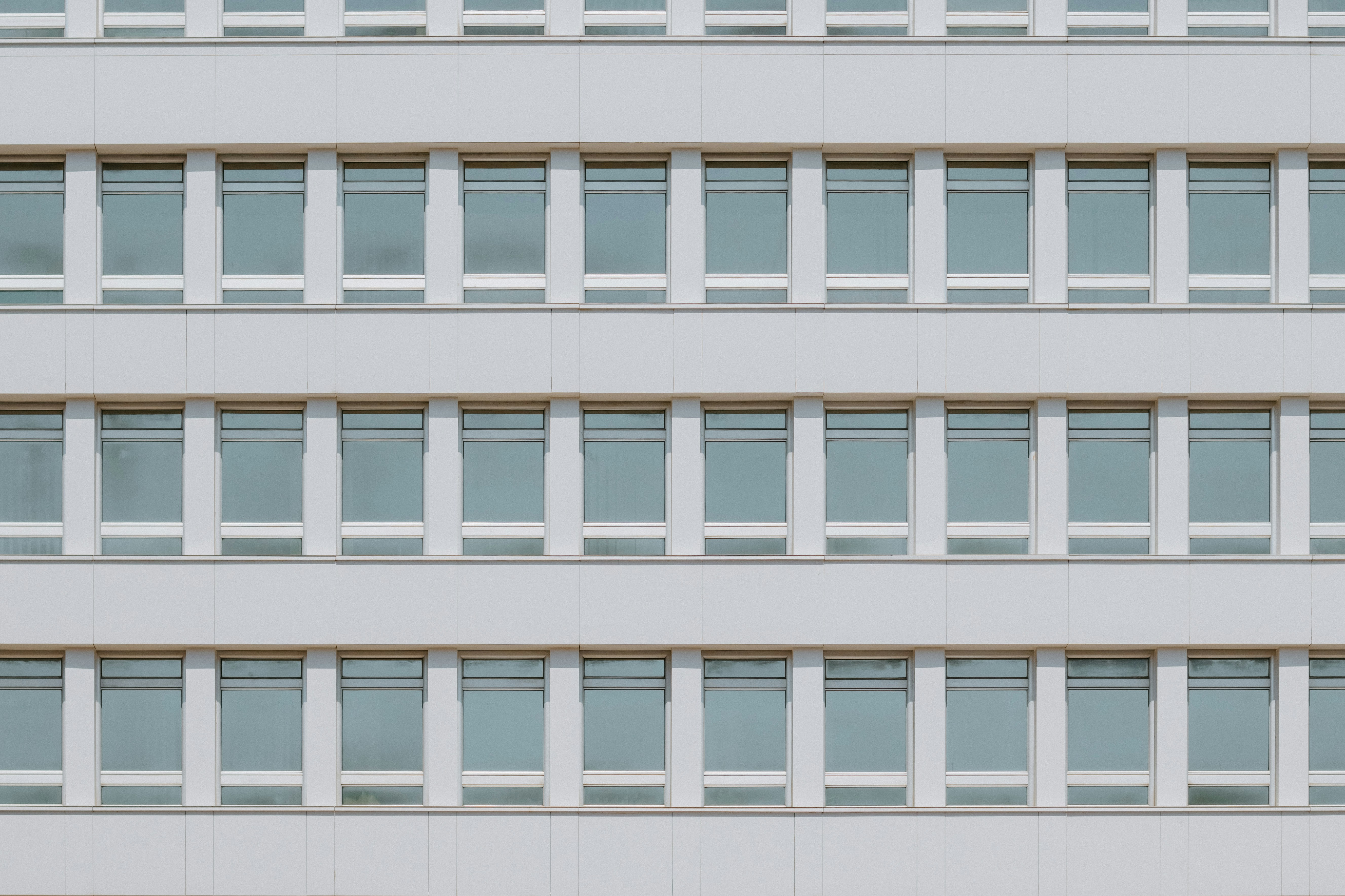 Symmetry in Glass: A Grid of Windows on a Modern Facade