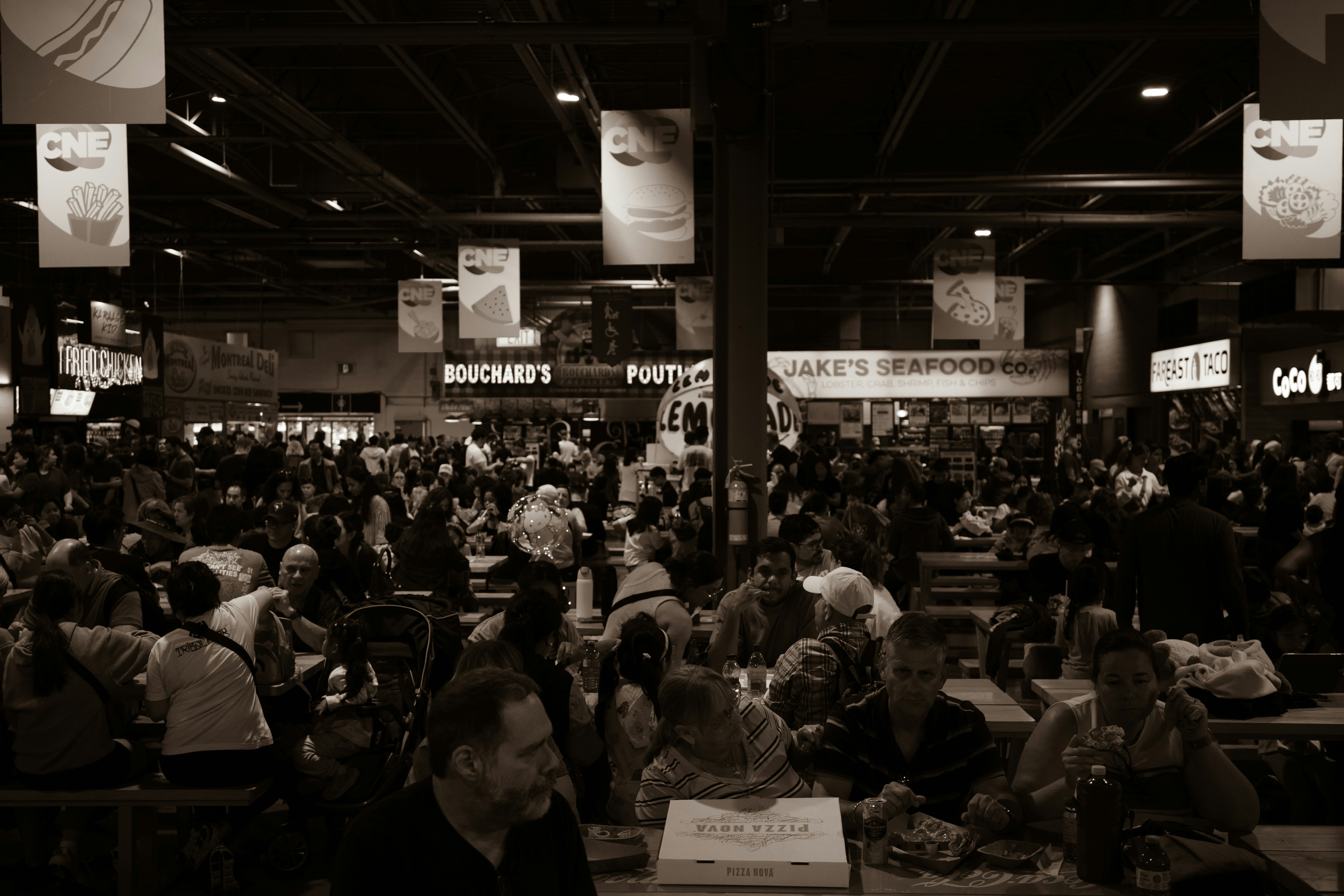 Crowded Market Hall: Faces, Feasts, and Flags Under Dim Lights