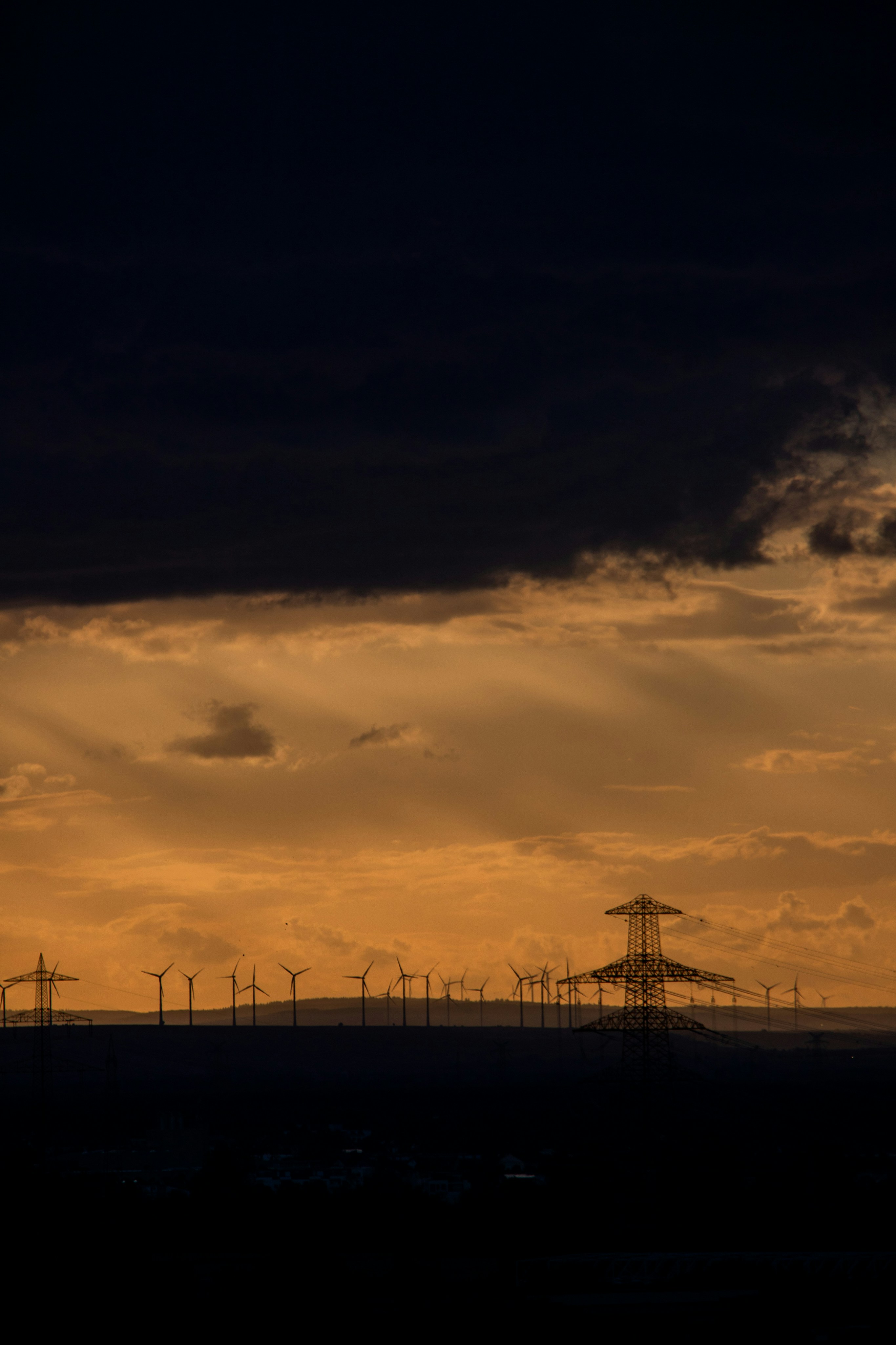 Golden Hour Gridlines: Wind Turbines on the Horizon