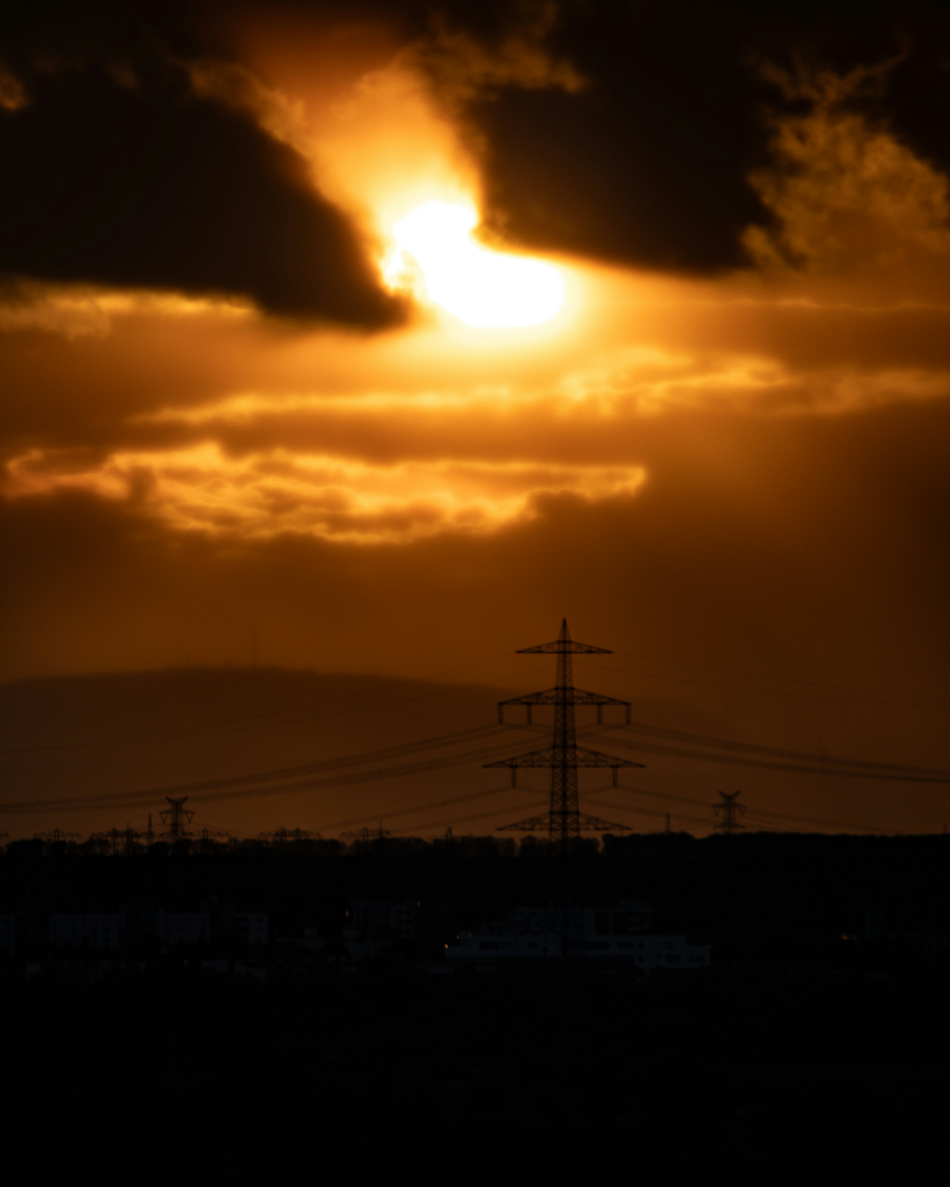 Sunset Ember Over the Grid: silhouetted Transmission Lines