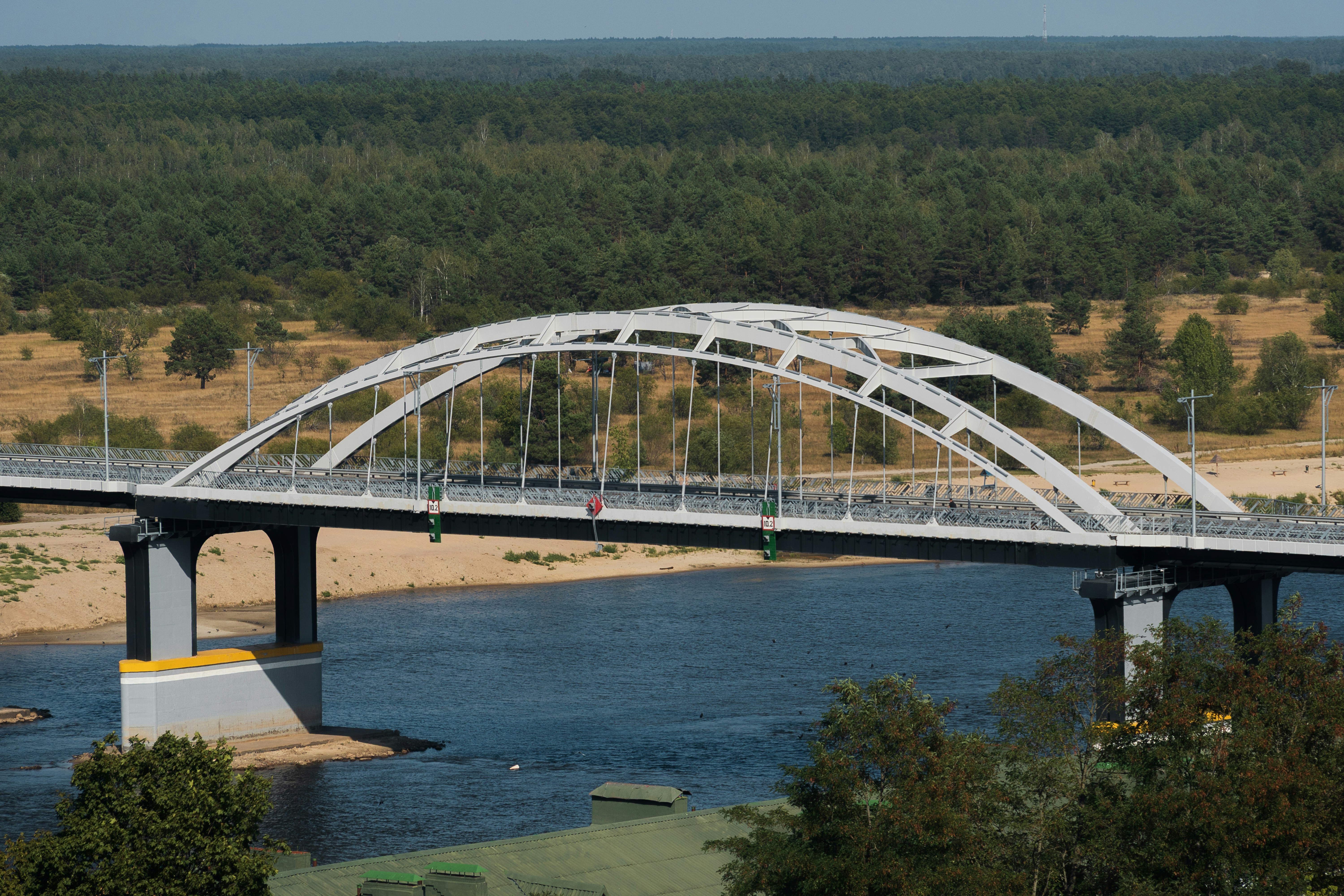 White Arch Bridge over Blue River: A Quiet Riverside Crossing