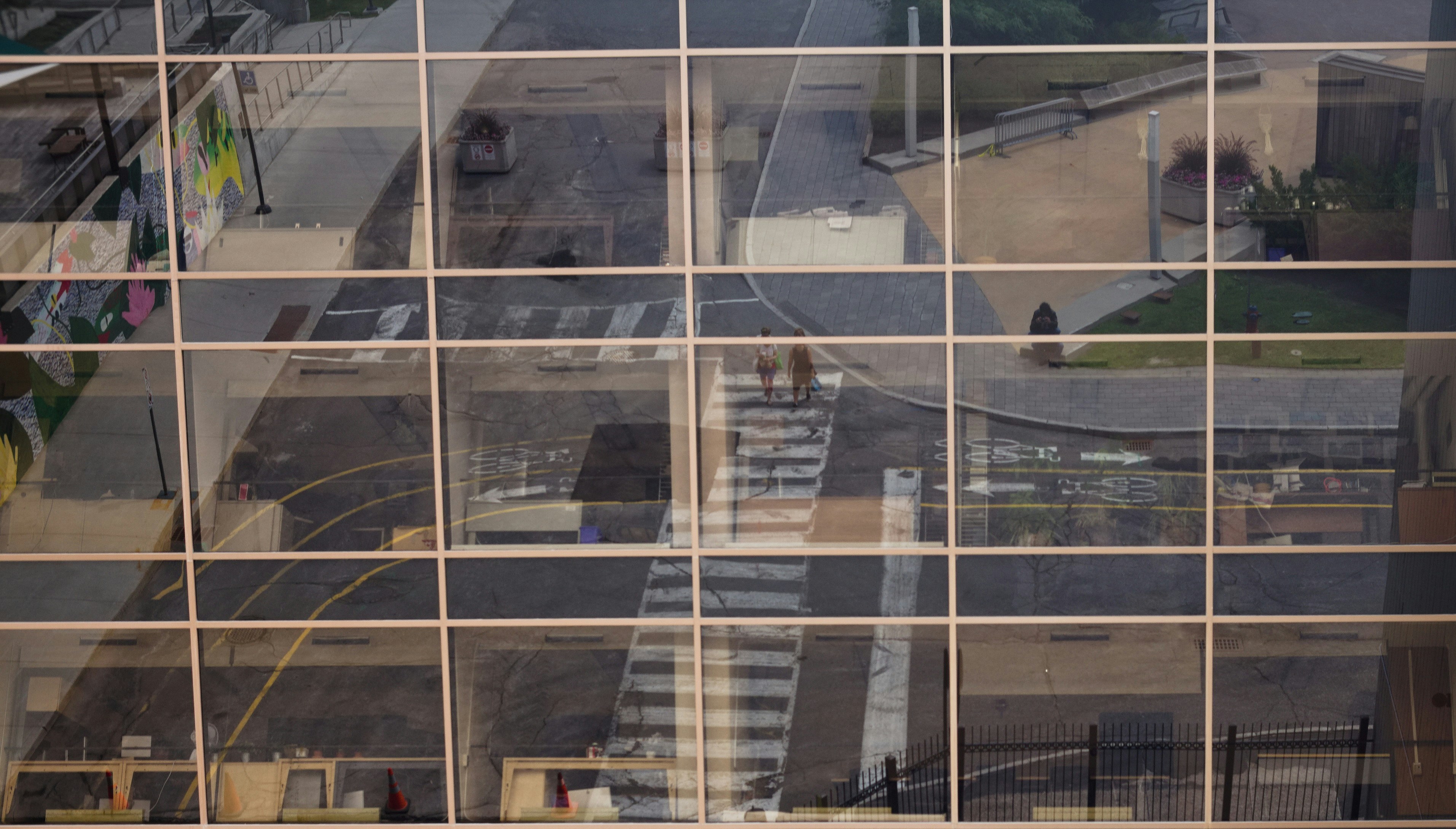 Grid Reflections: A Bird’s-Eye View Through a Glass Facade