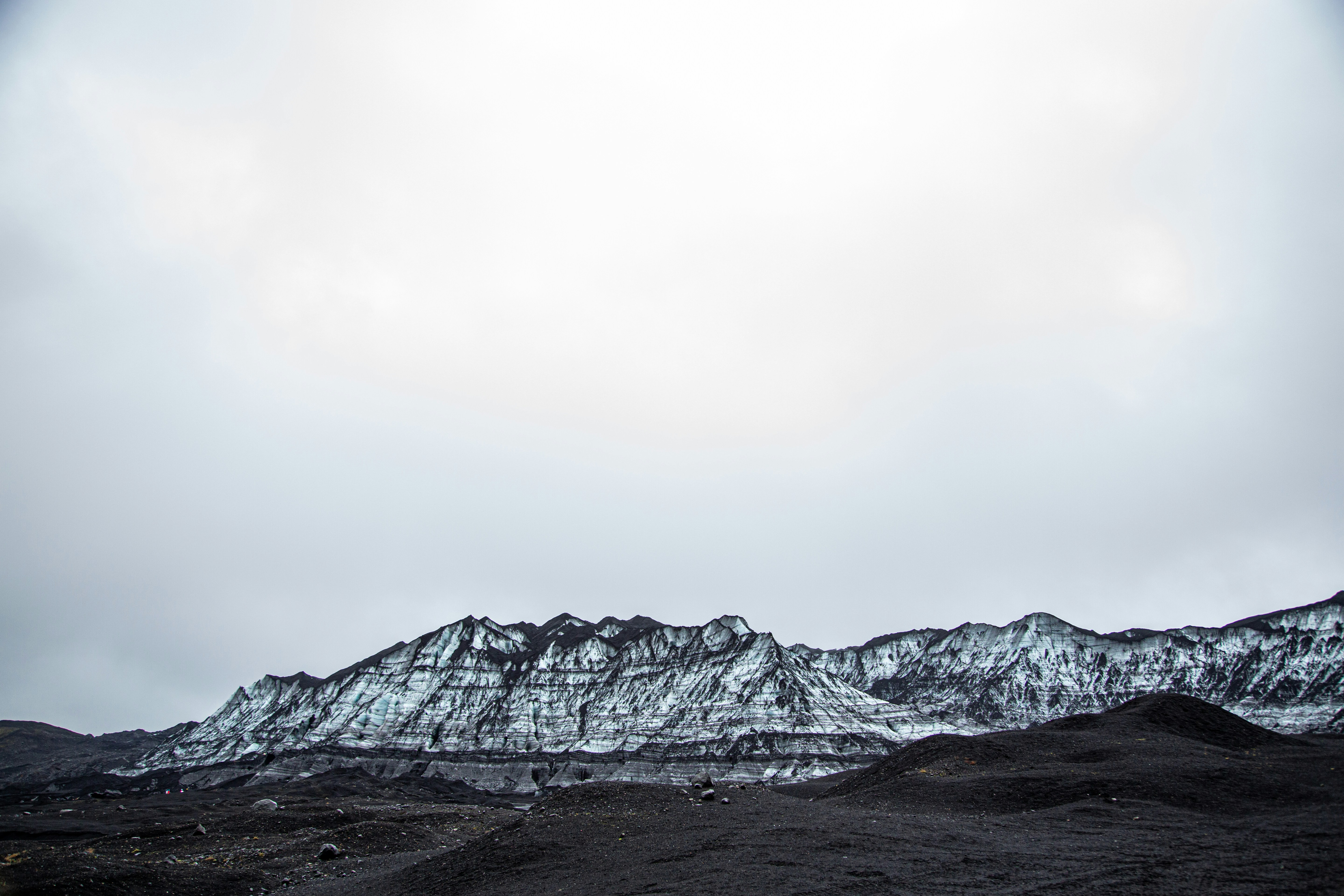 Snow-etched Ridge under a Pale Sky