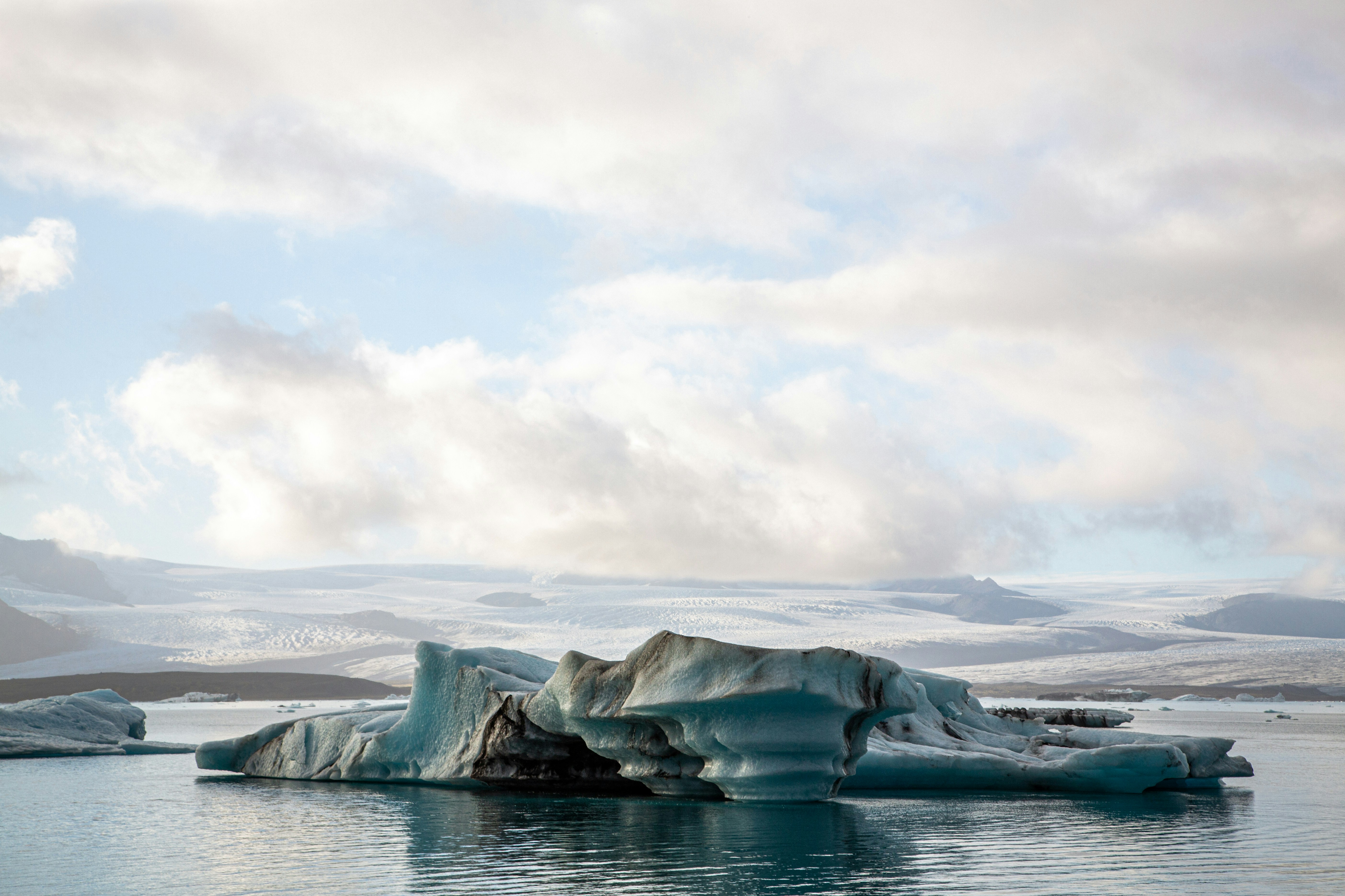 Floating Glacier Echoes Across Calm Polar Waters