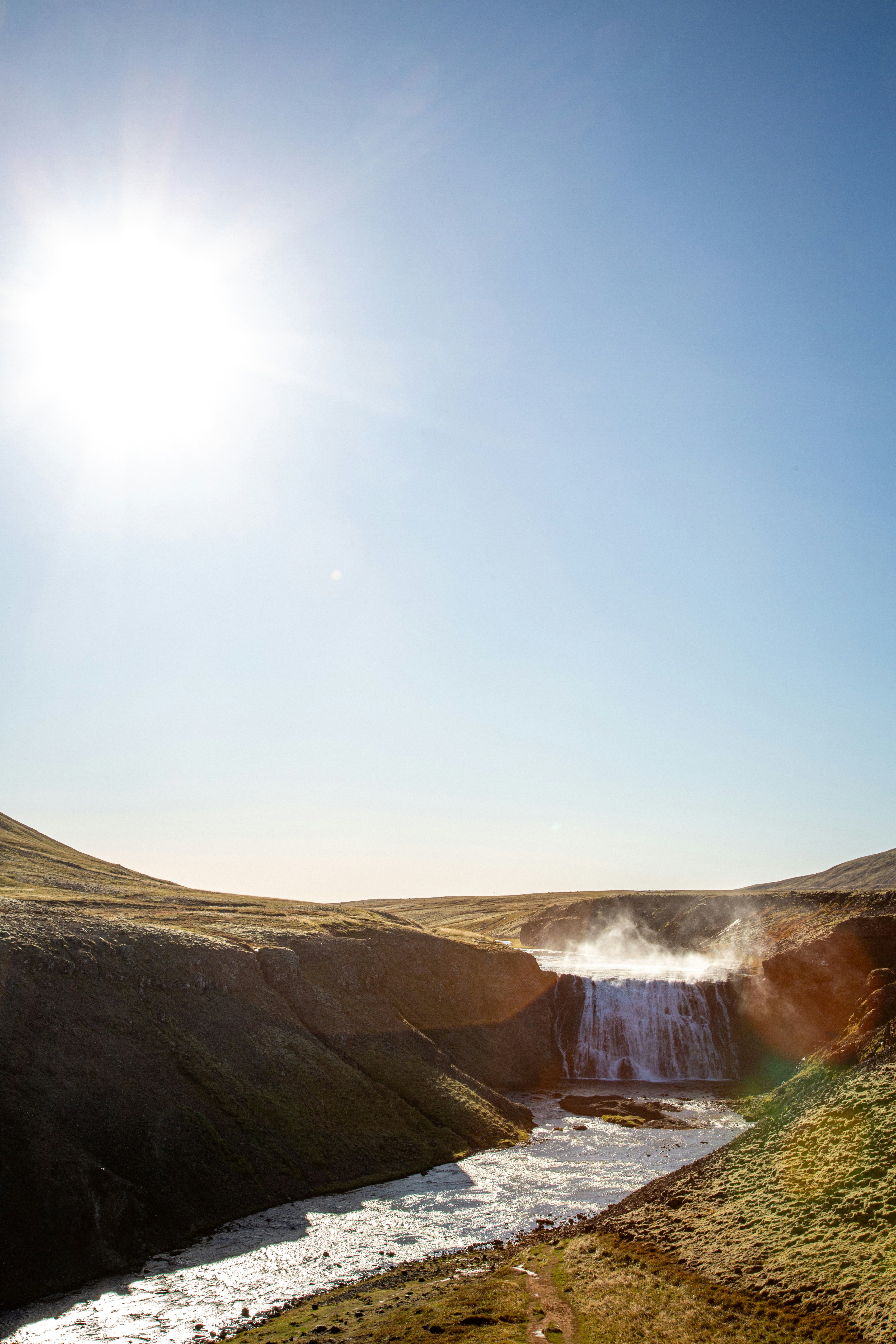 Sunlit Gorge: A Quiet Cascade Under Open Skies