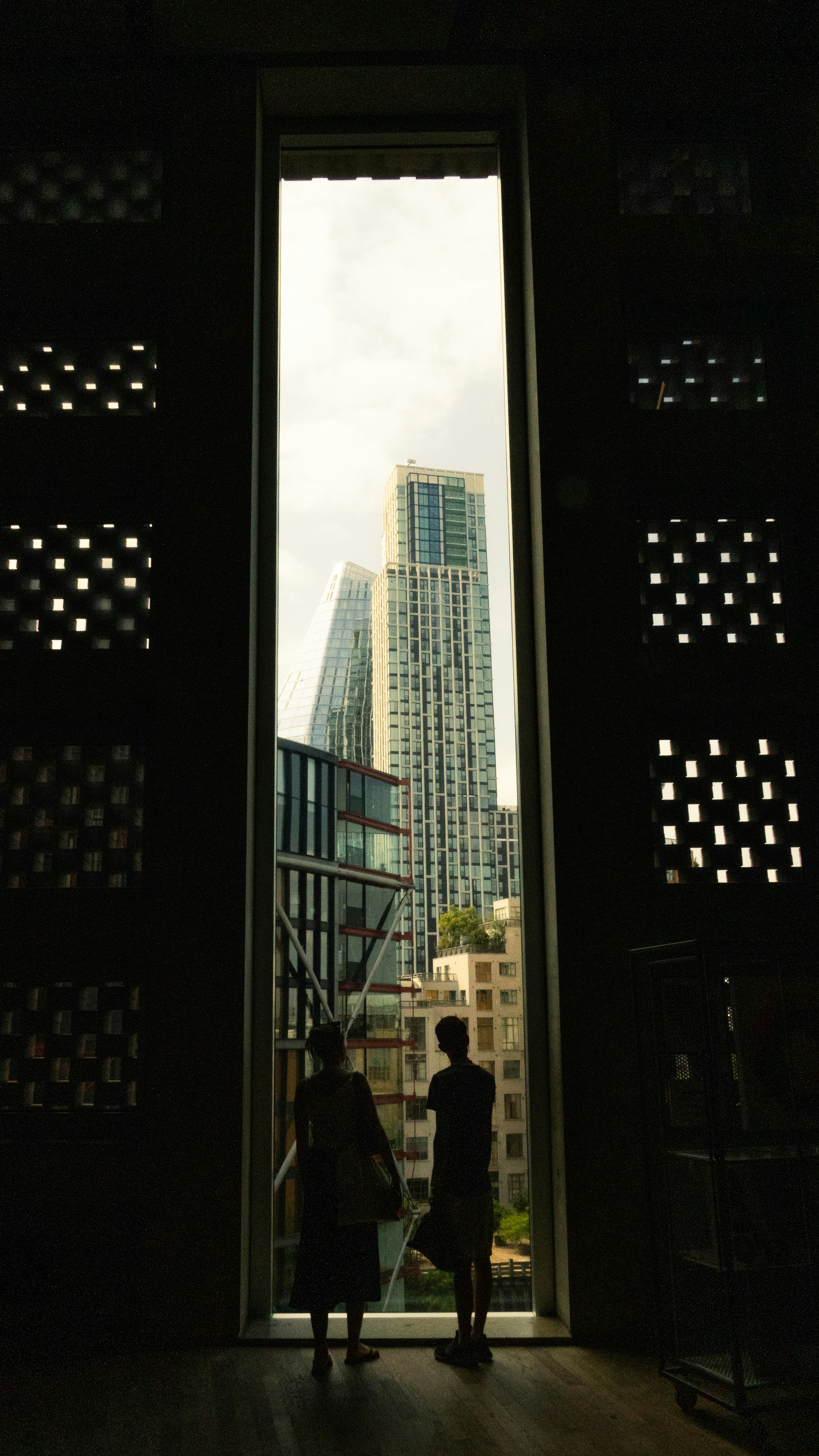 Skyward Gap: Towers Framed by a Narrow Window