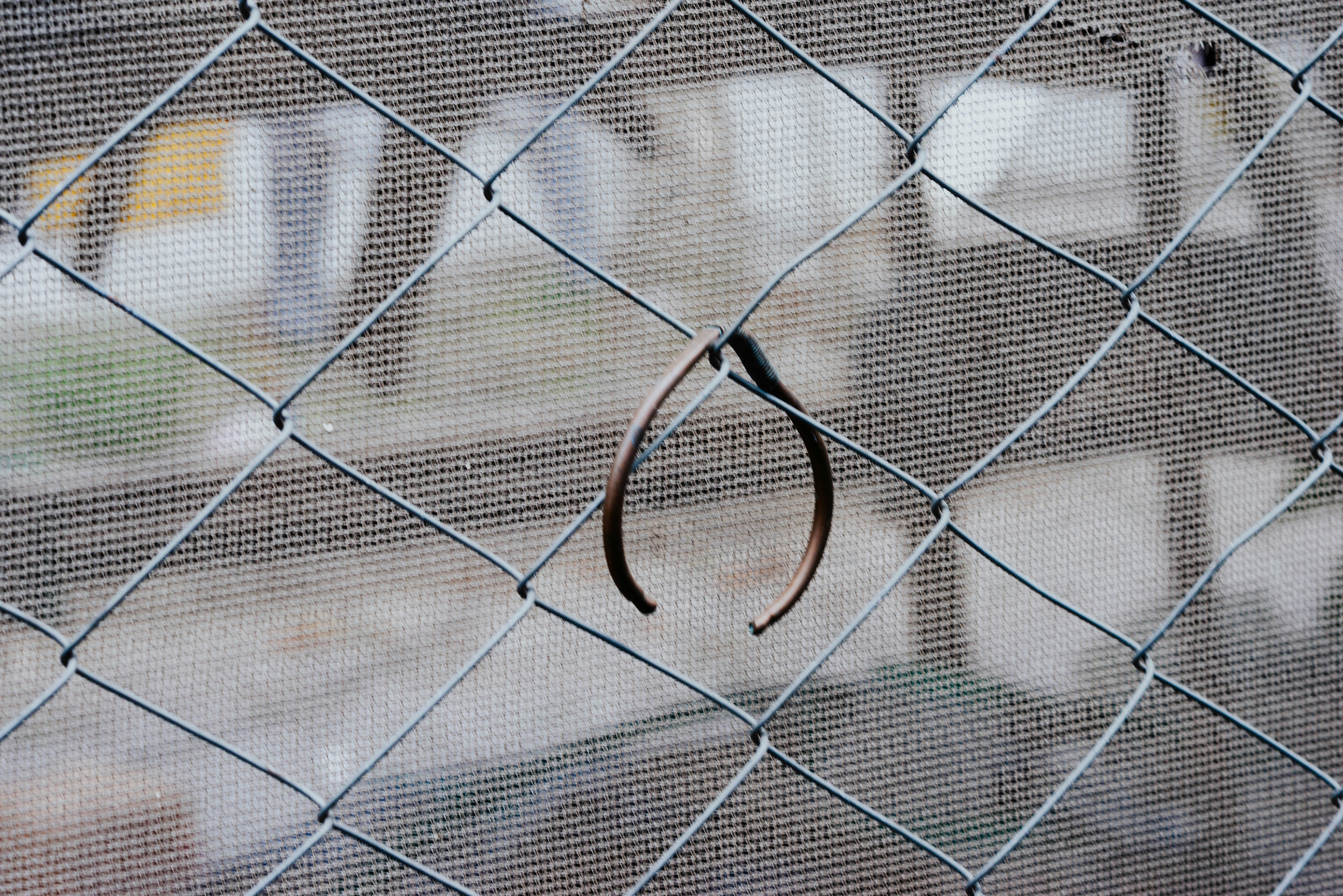 Bent Ring on a Chain-Link Barrier