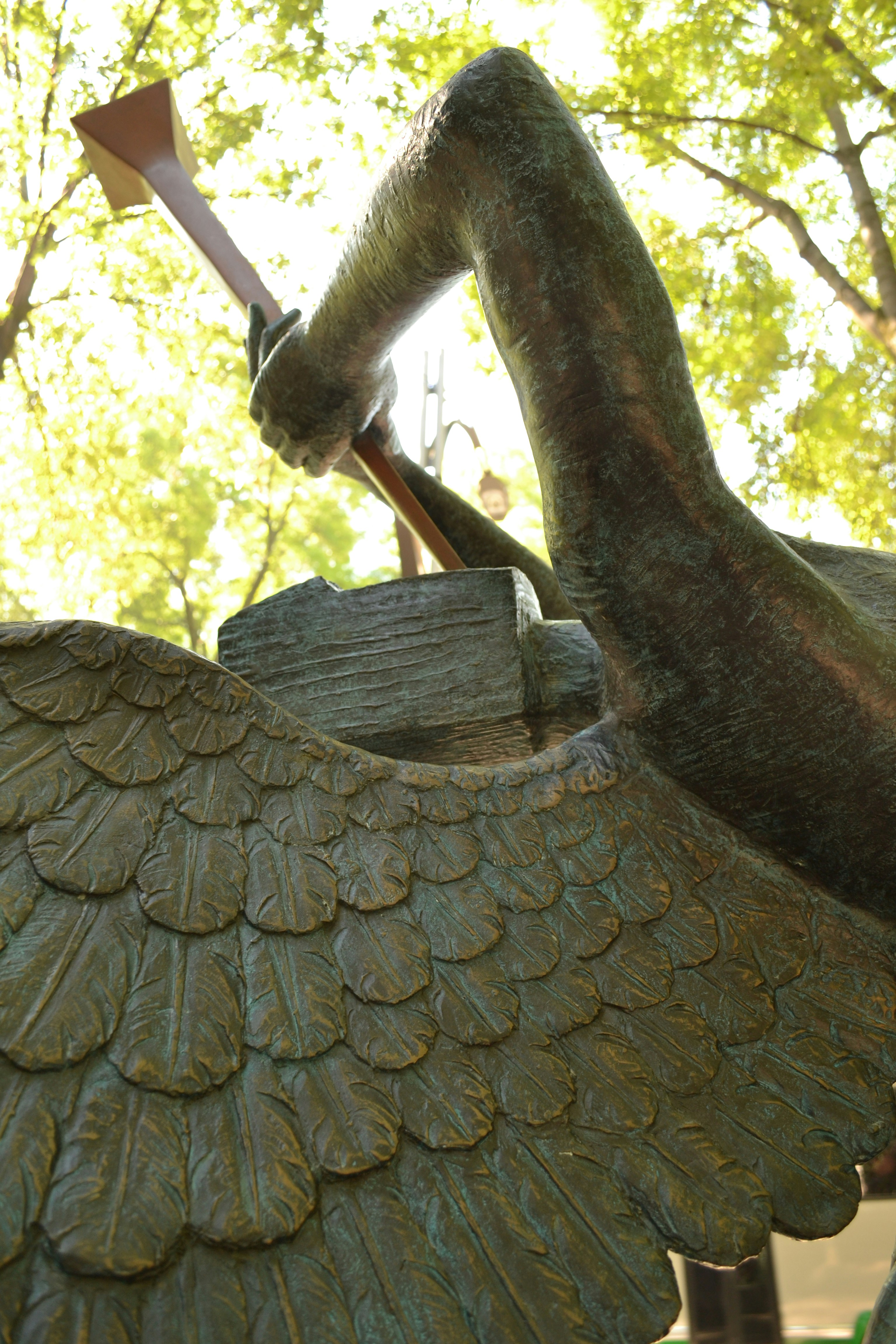 Bronze Wing: A Sculpted Goose–like Form Reaches Toward Light