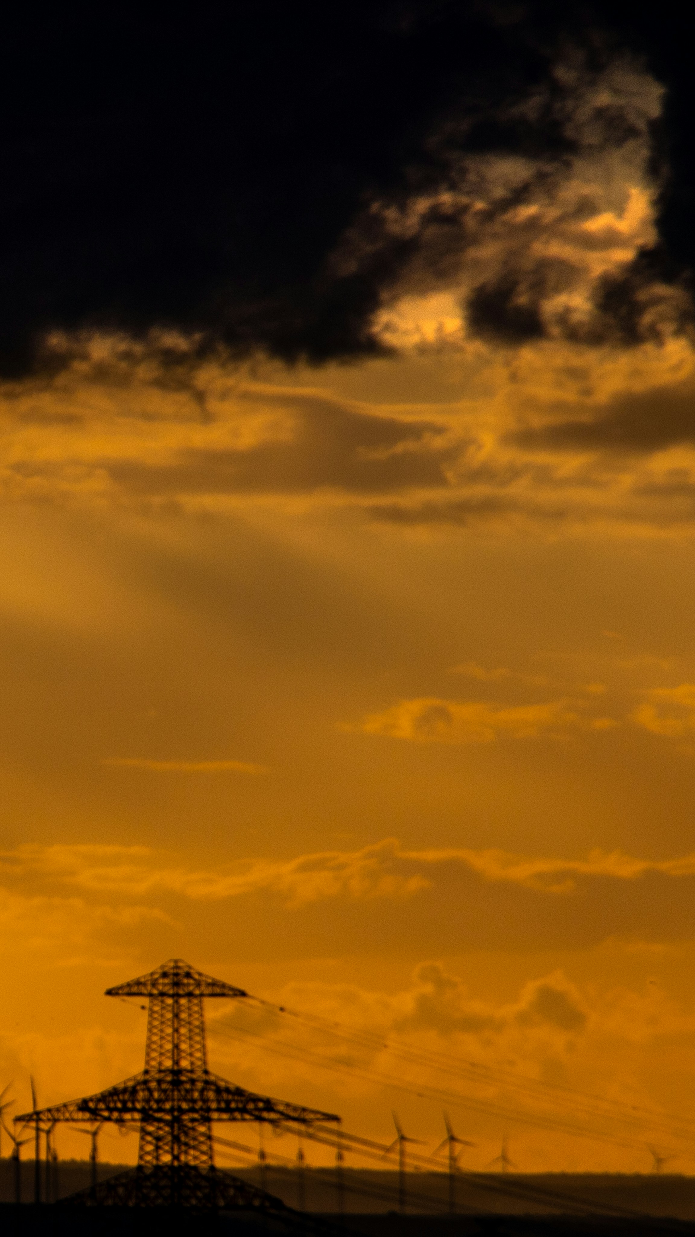Golden Hour Gridwork: Power Lines at Dusk