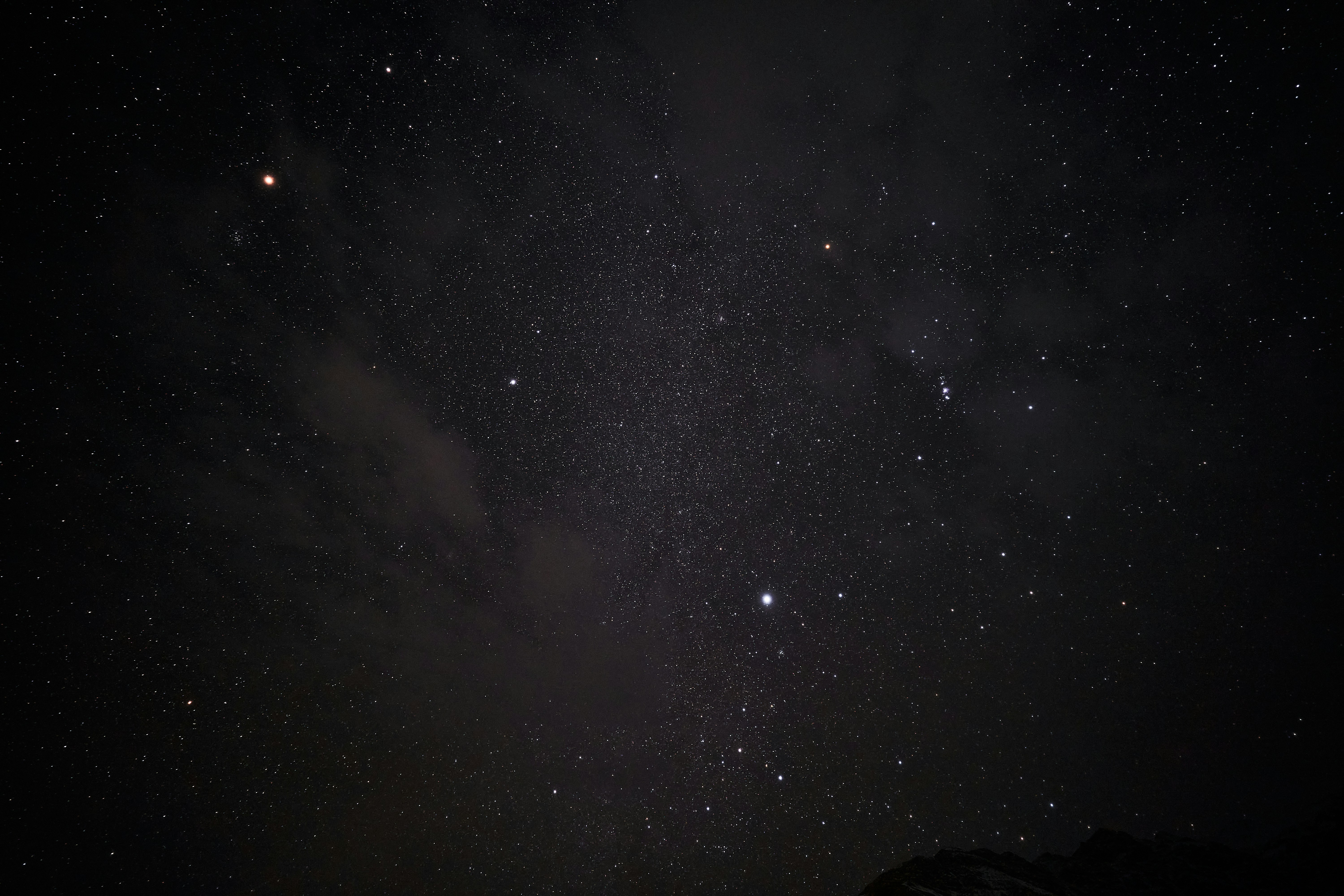 Cosmic Spray: A Star-Pierced Night Above the Horizon