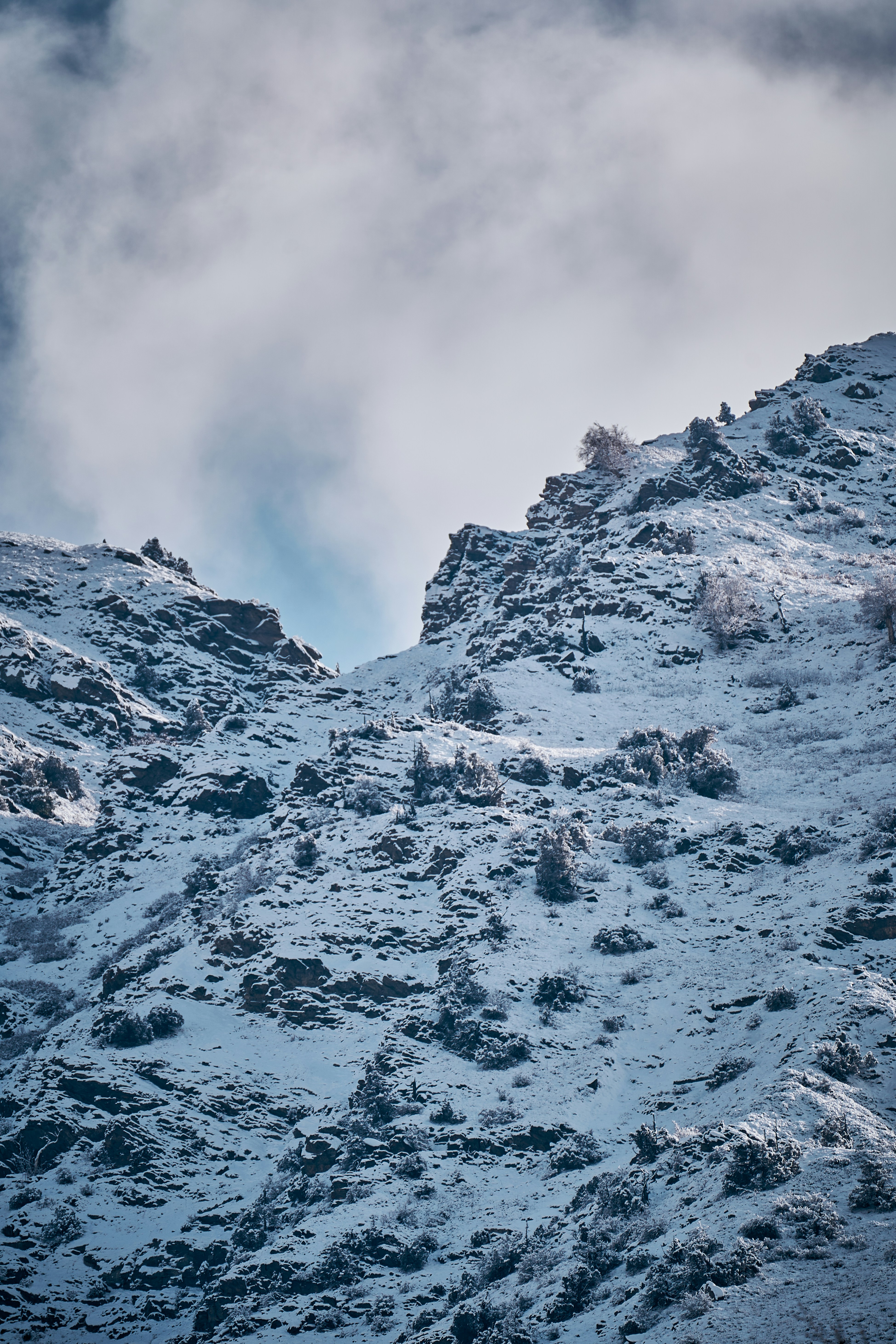 Snow-Kissed Ridge under a Quiet Sky