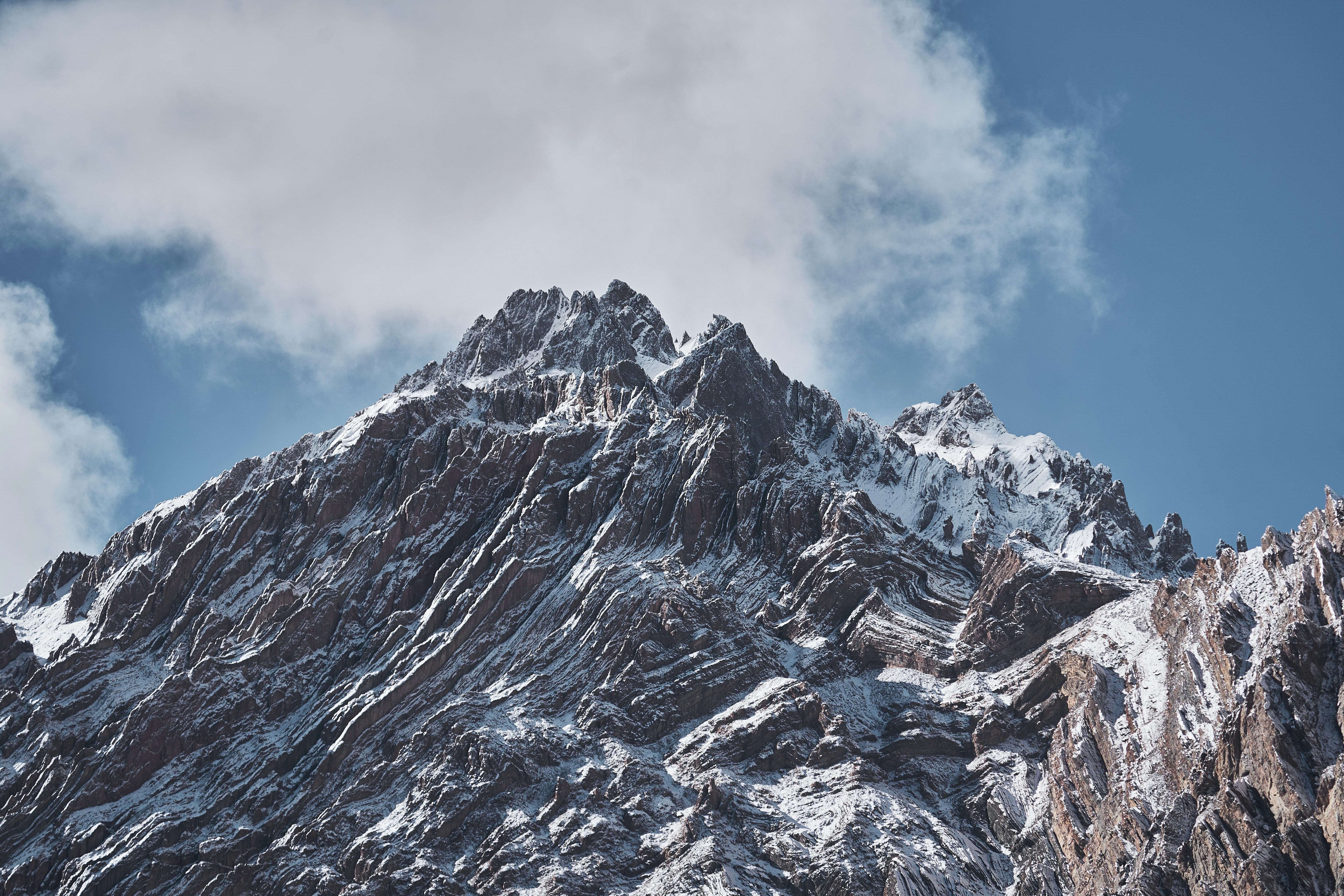 Crowned Peaks Under a Quiet Sky