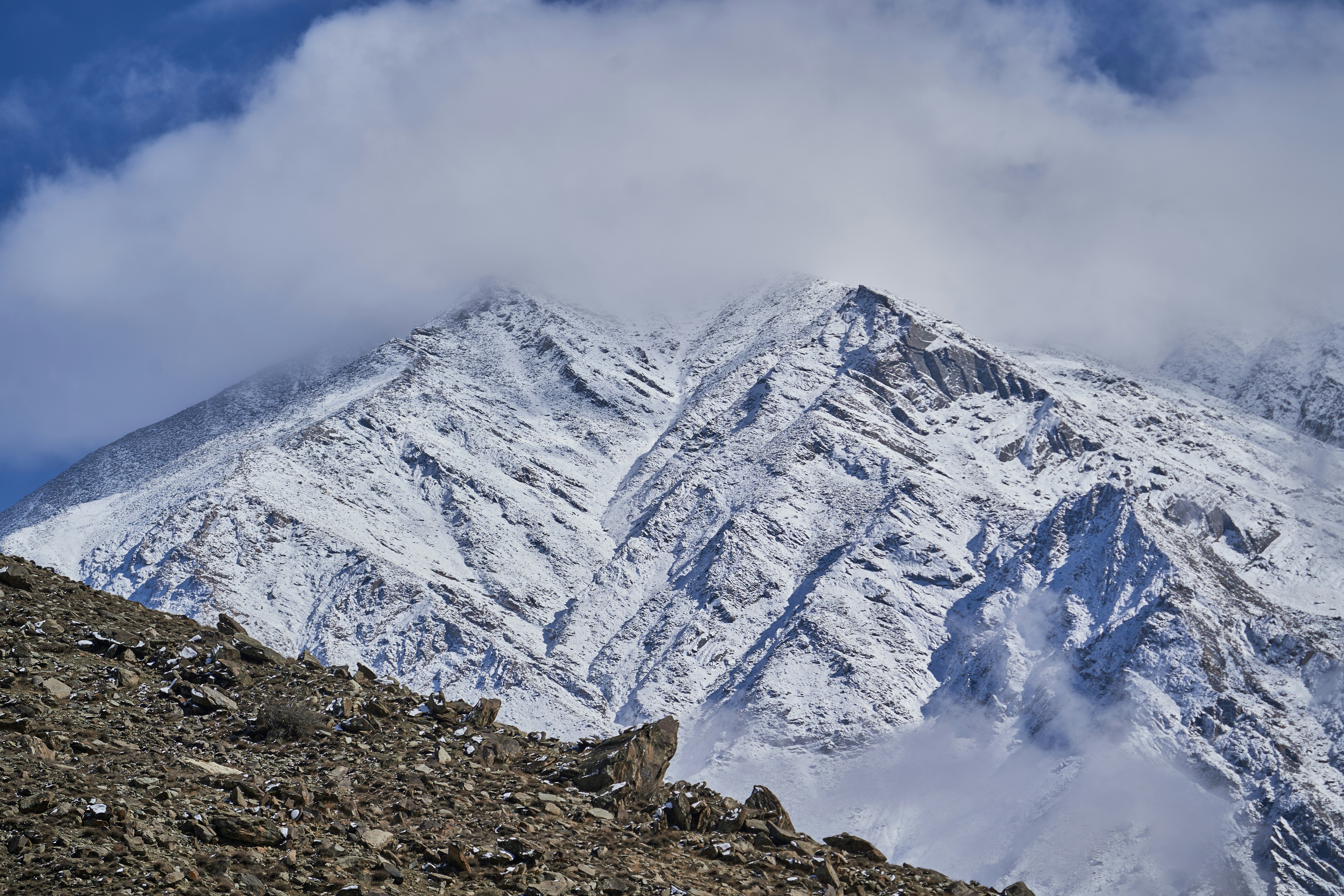 Snow-crowned Peaks Above a Harsh At-Ridge Slopes