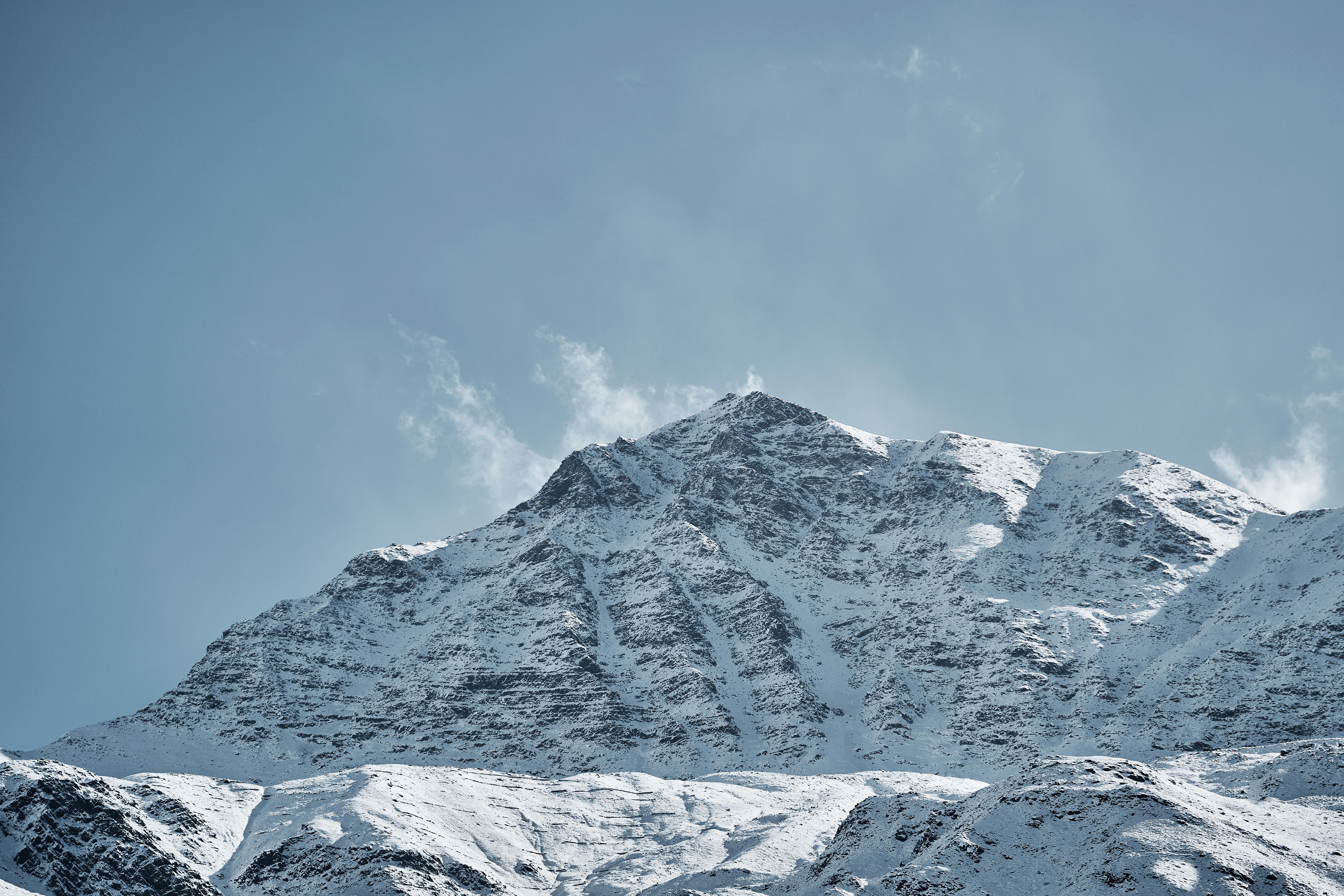 Snow-Crowned Summit Under Clear Sky
