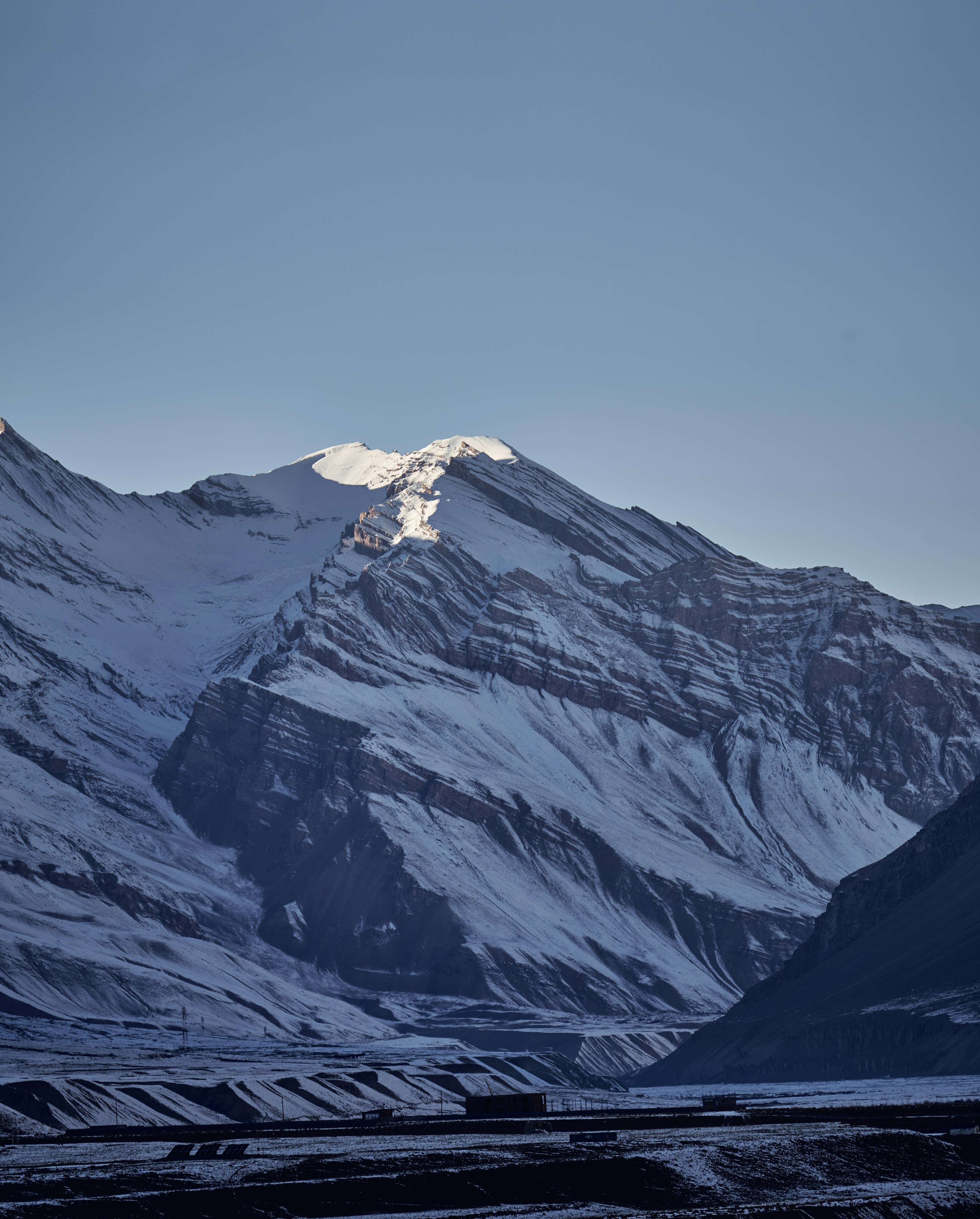 Snowbound Summit under a Clear Alpine Sky