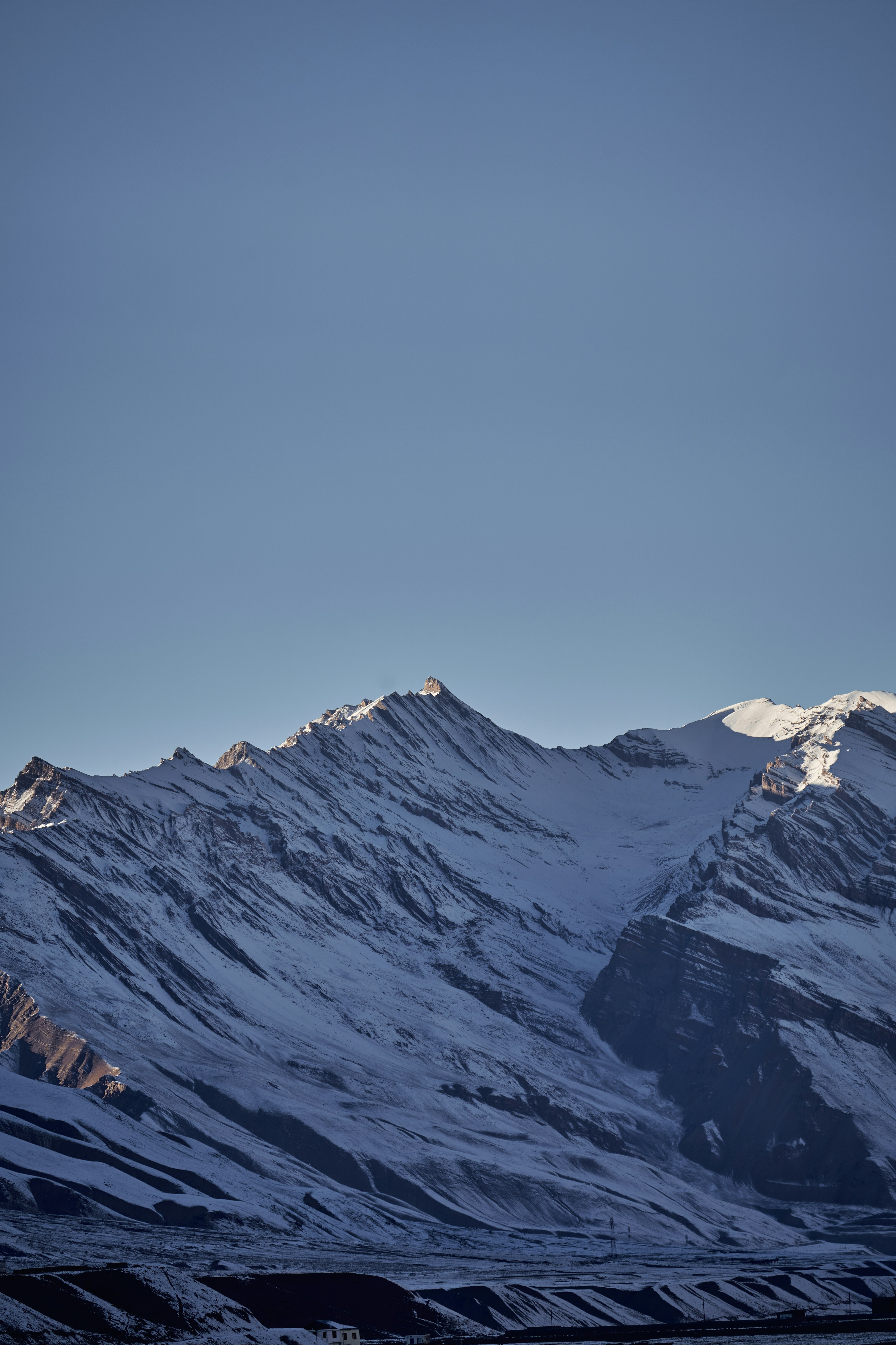 Snow-swept Peaks under a Clear Alpine Sky
