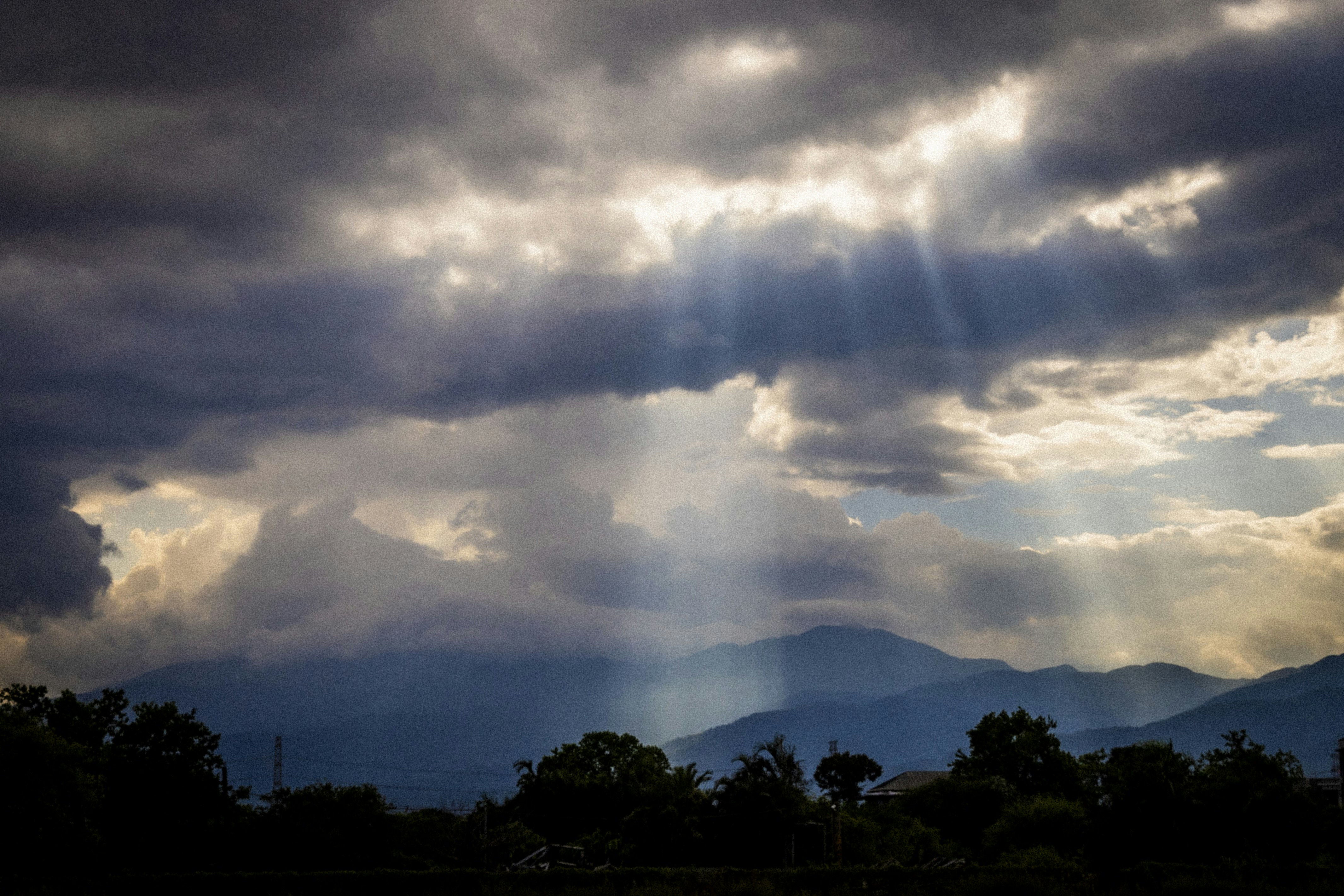 Sunbeams Piercing a Calm Ridge