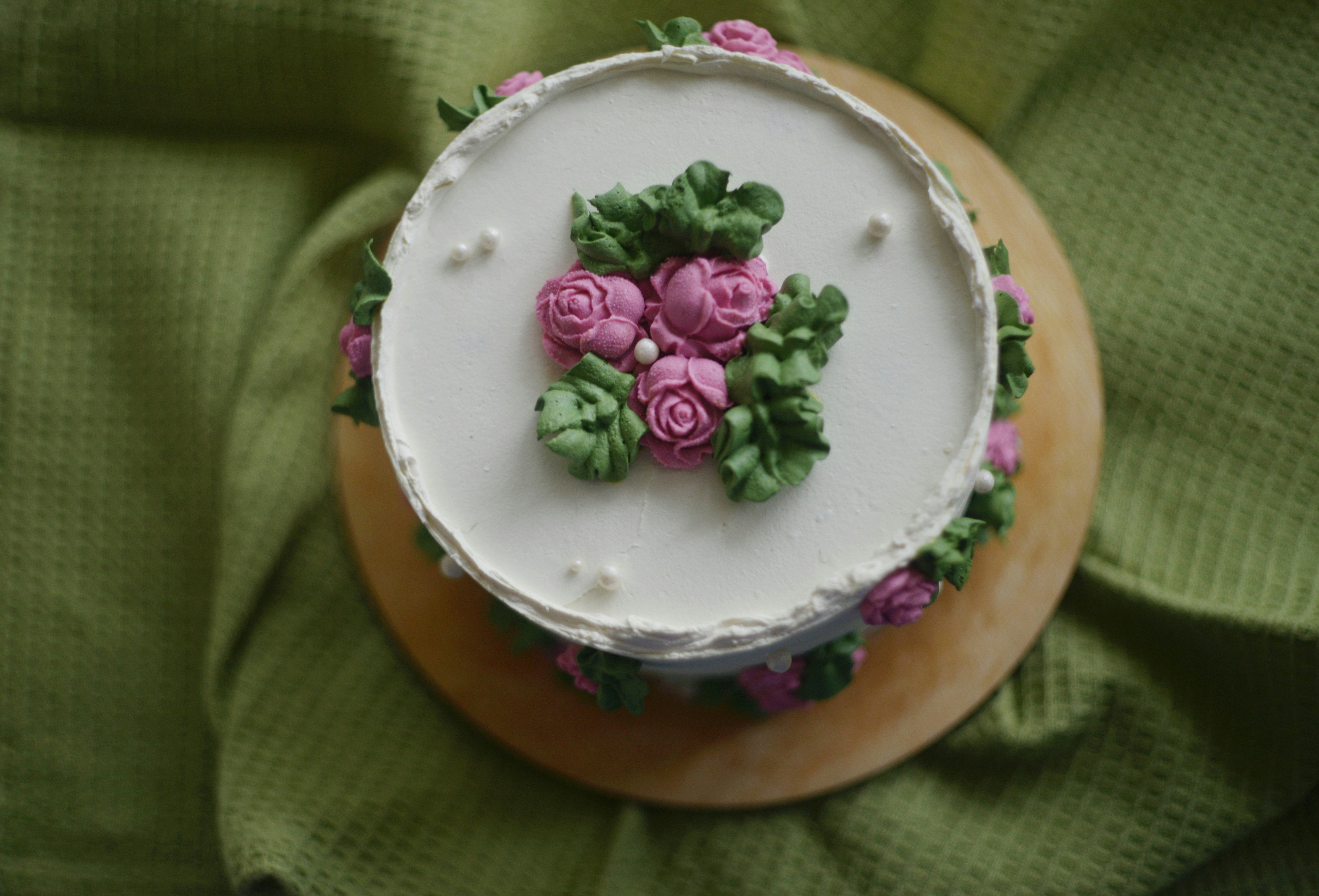 Ornate Roses on White Frosted Cake Centerpiece