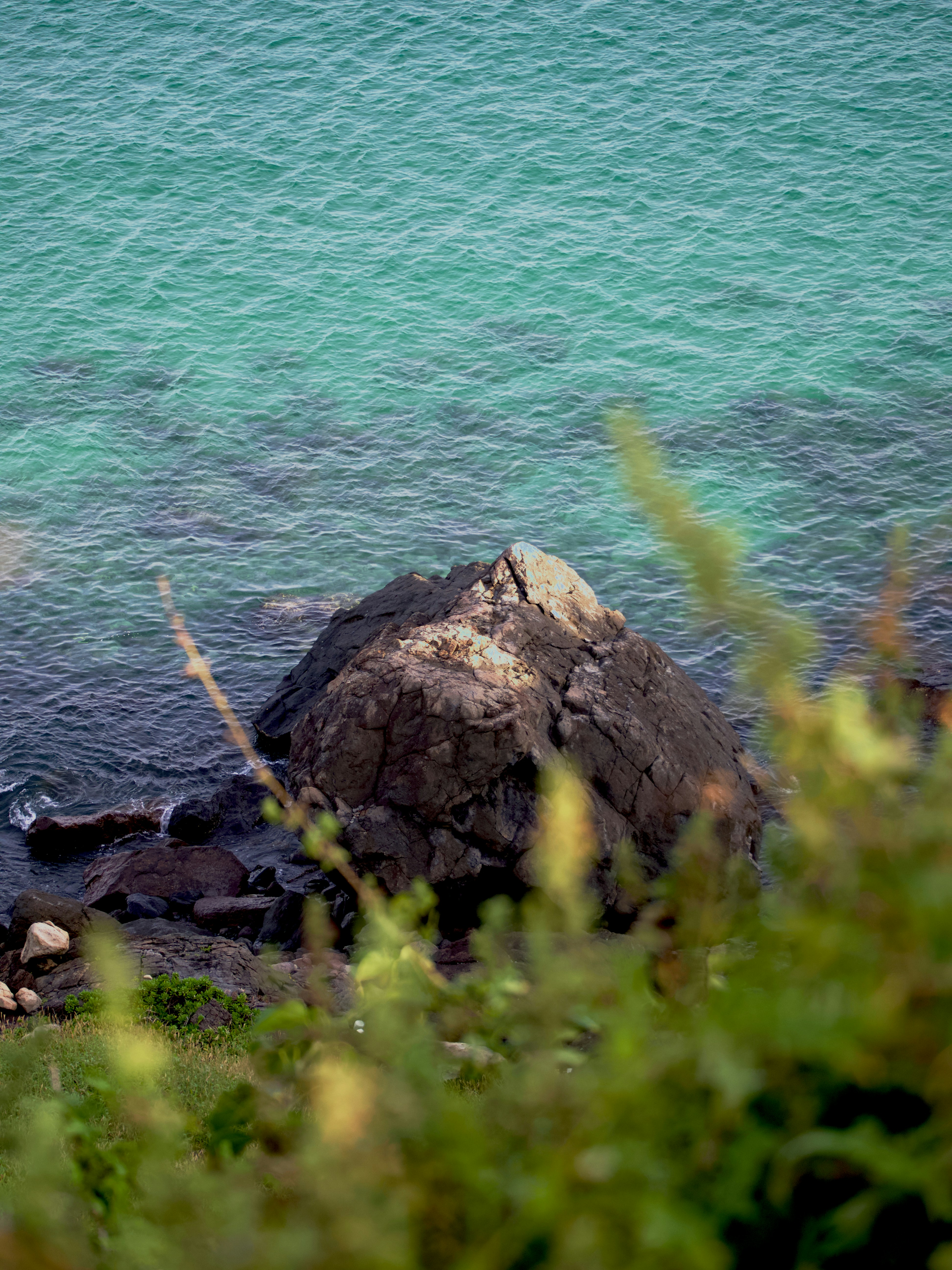 Rocky Ledge Meeting the Turquoise Sea
