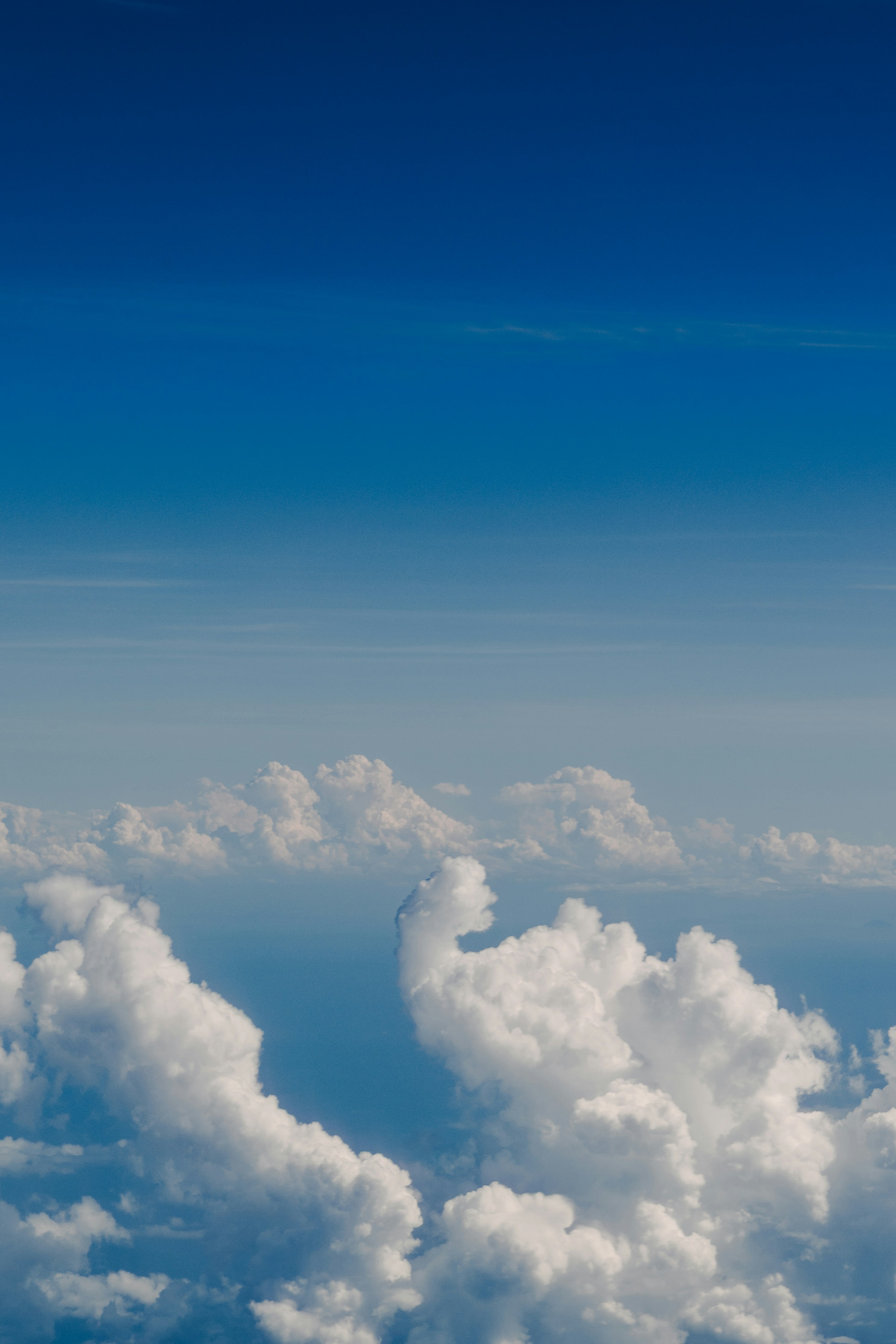 Skybound Layers: A Cascade of Clouds Above the Horizon