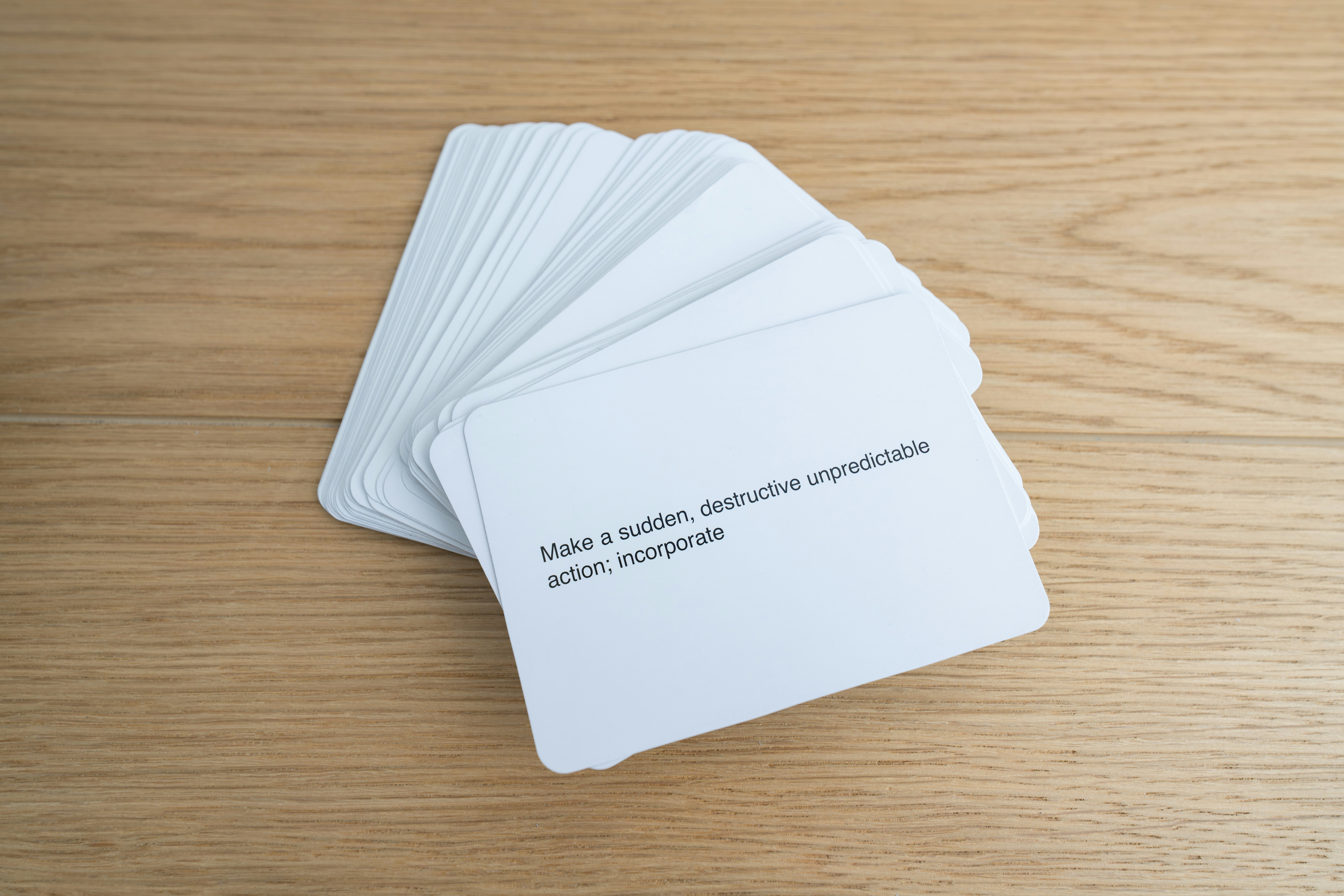 Deck of Prompts: A Quiet Bank of Ideas on a Wooden Table