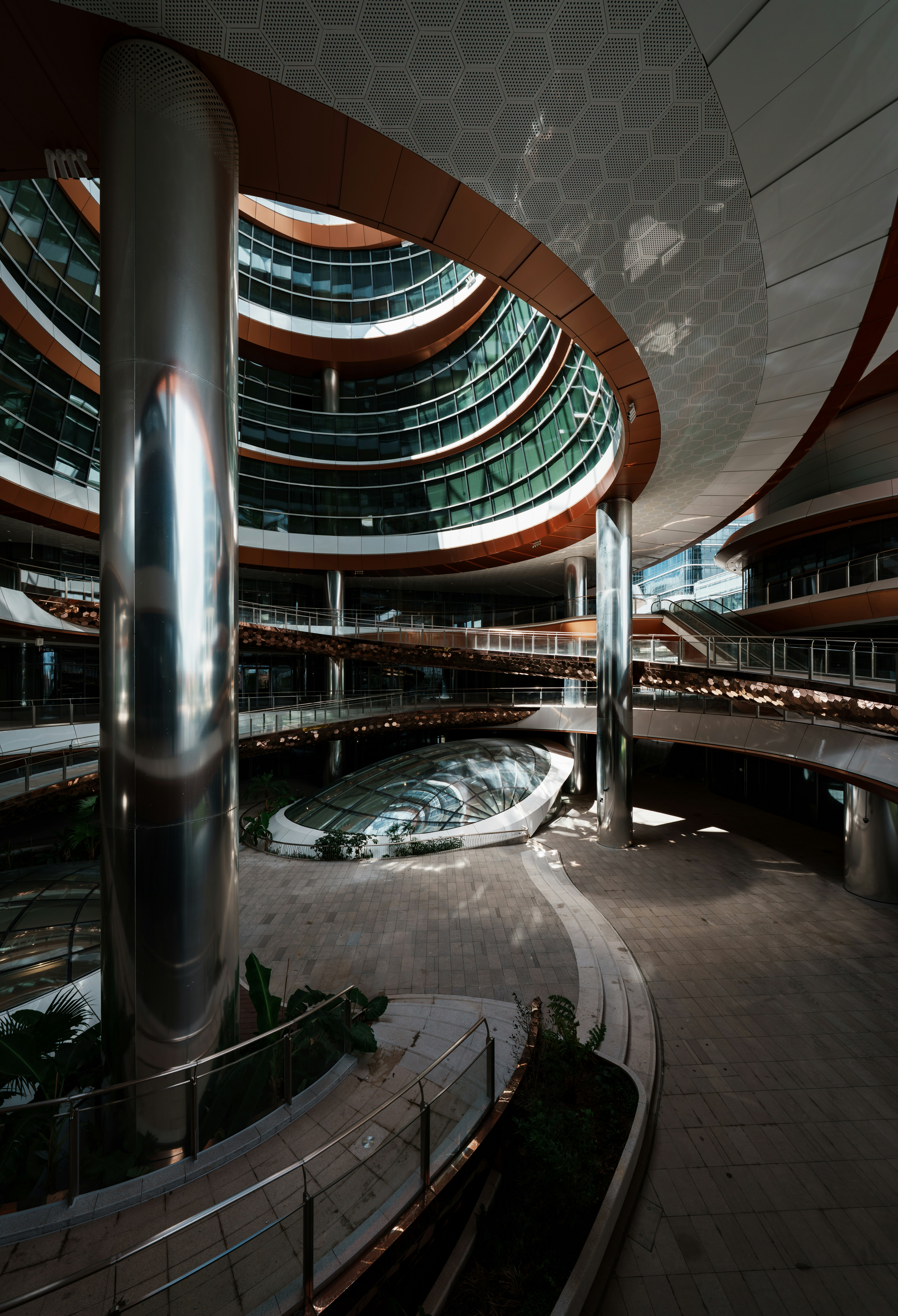 Curved Atrium Echoes: Steel Columns and Glass Wings