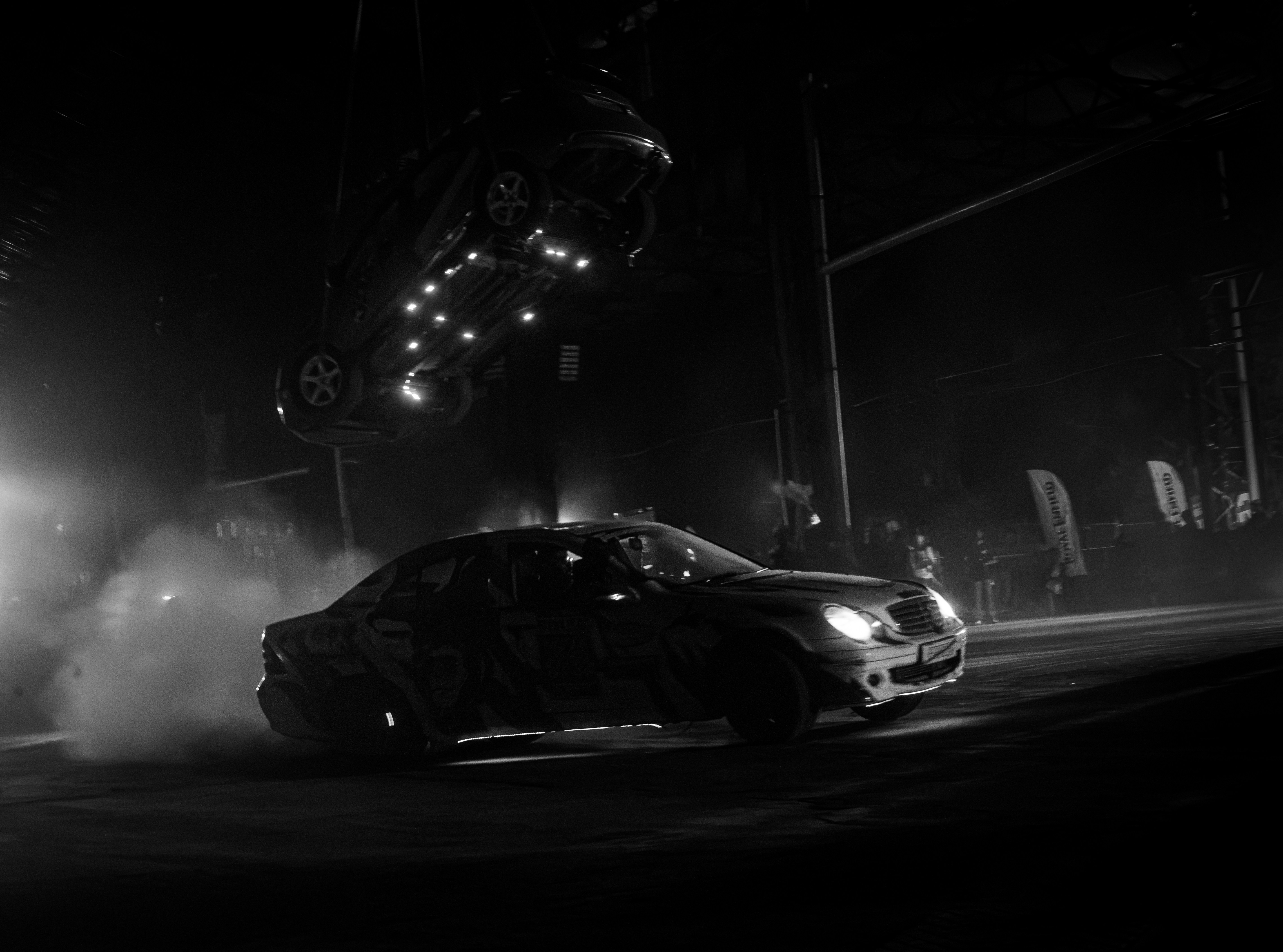 Midnight Drift: Neon Smoke and a Car in Freefall Light
