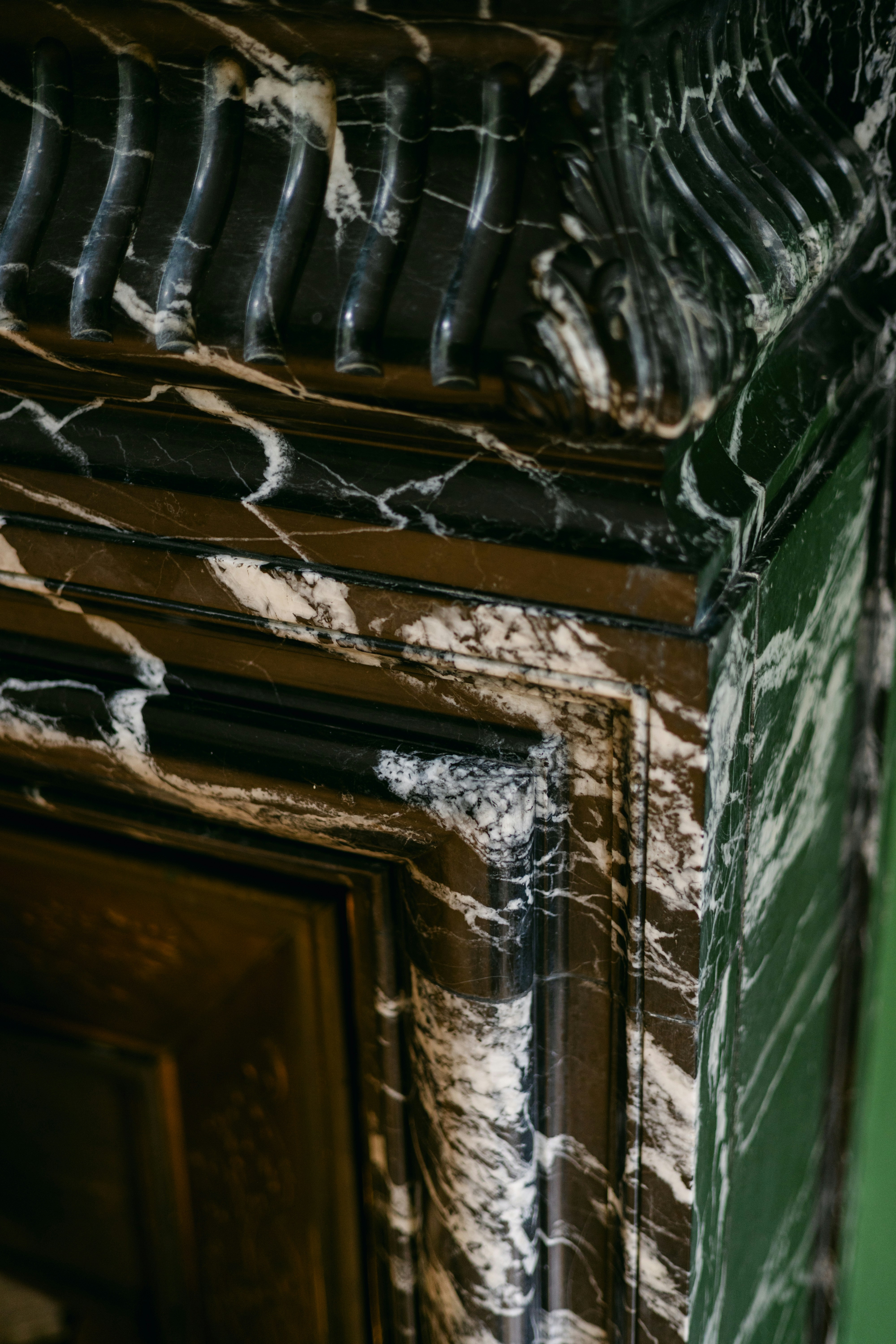 Marble Framing: A Weathered Doorway in Deep Green