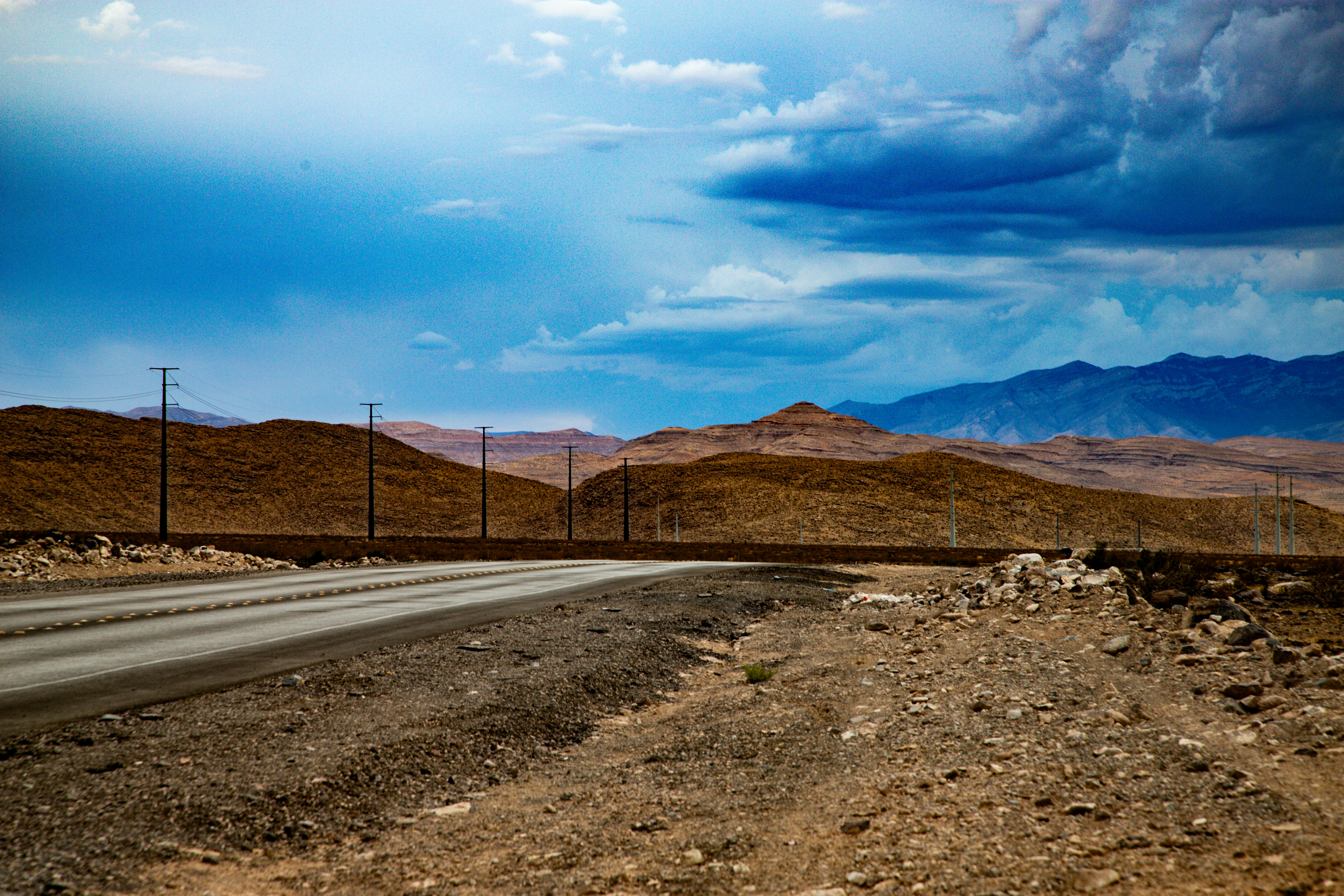 Desert Horizon Road under a Striated Sky