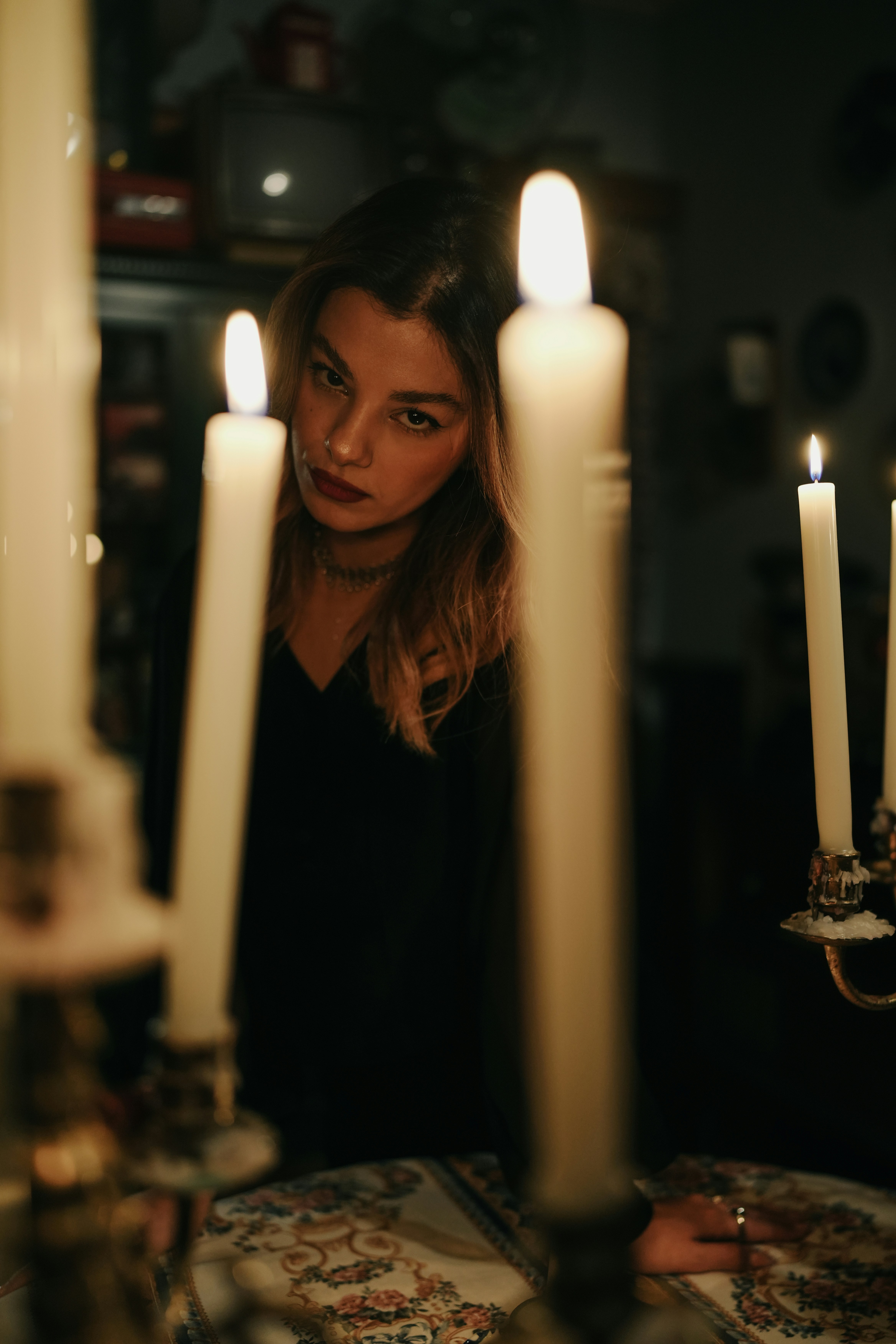  candlelit gaze: a moody portrait between flames