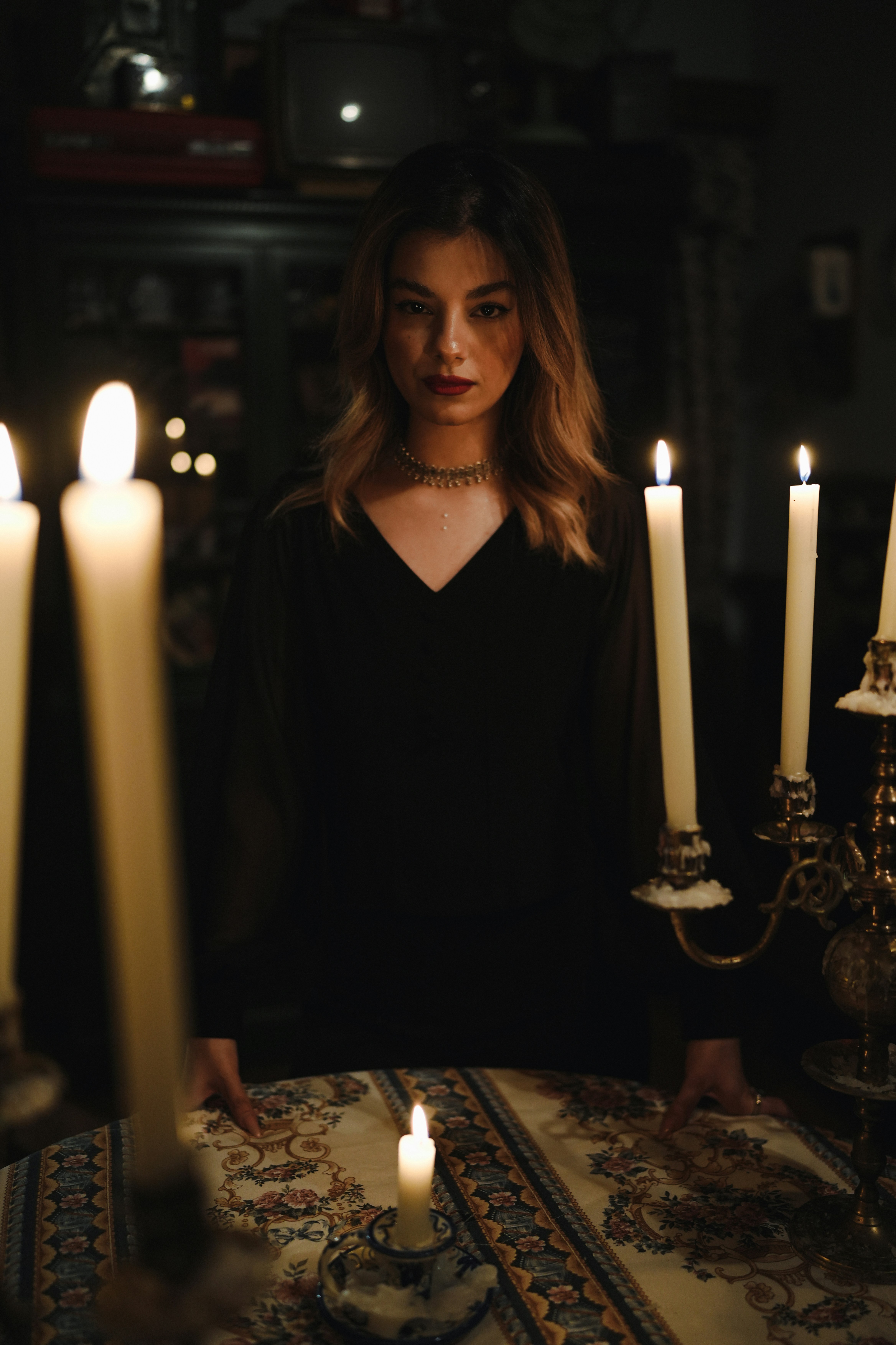 Candlelit Portrait: Quiet Intensity Across a Table of Shadows
