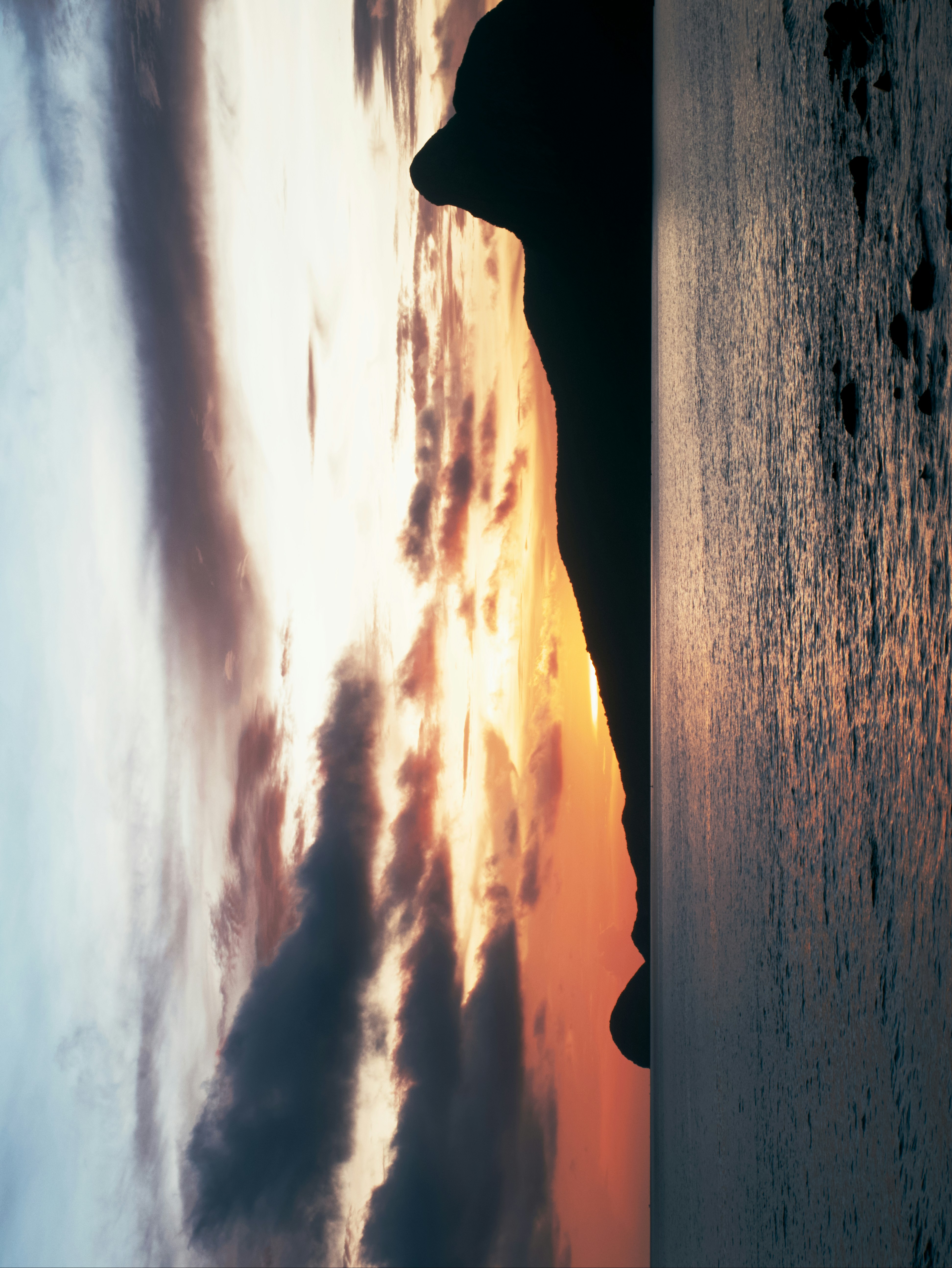 Sunset Over the Shallows: A Silhouette at the Edge of Light