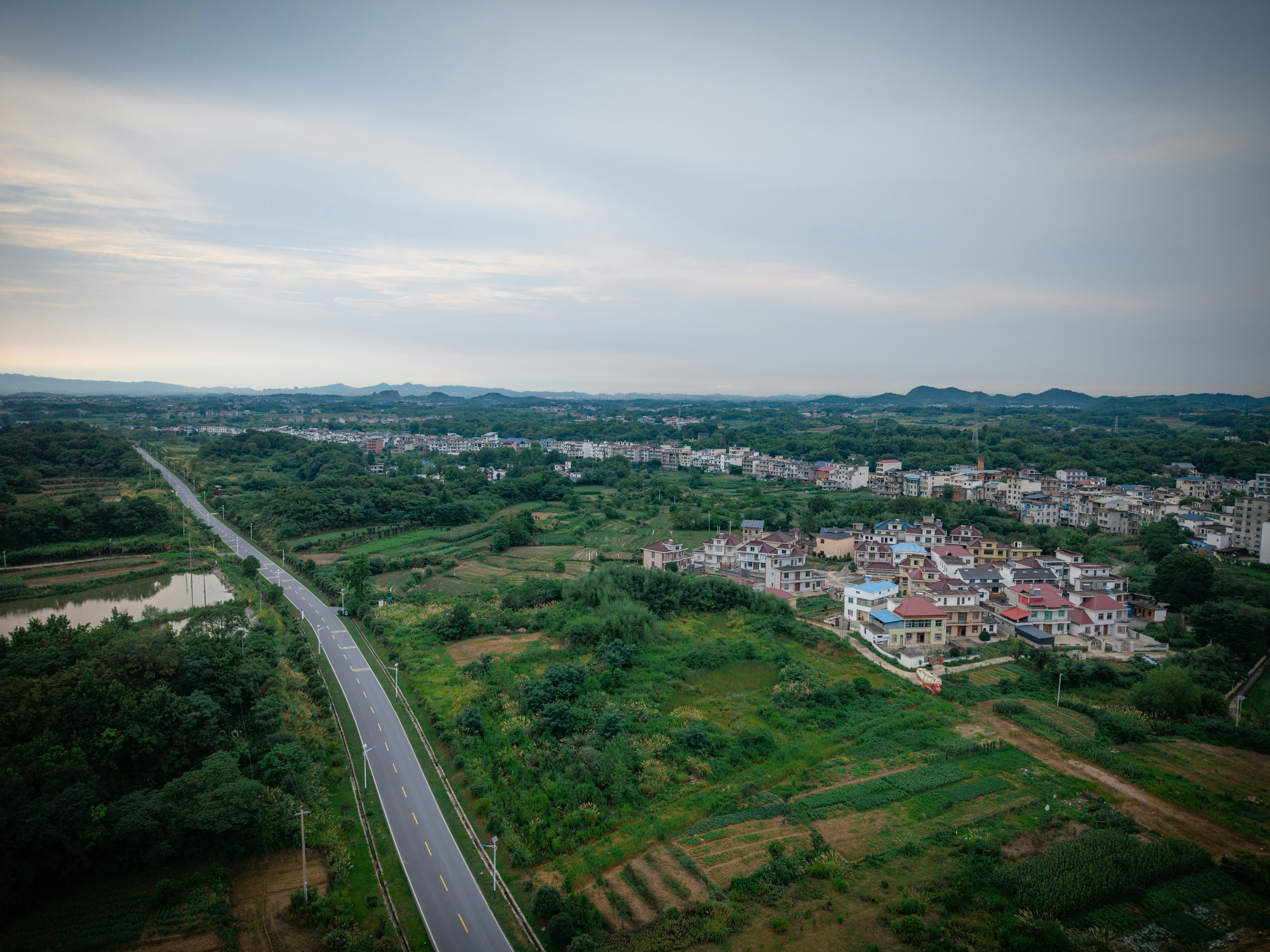 Aerial Greenway: Village Grid Meets Winding Highway