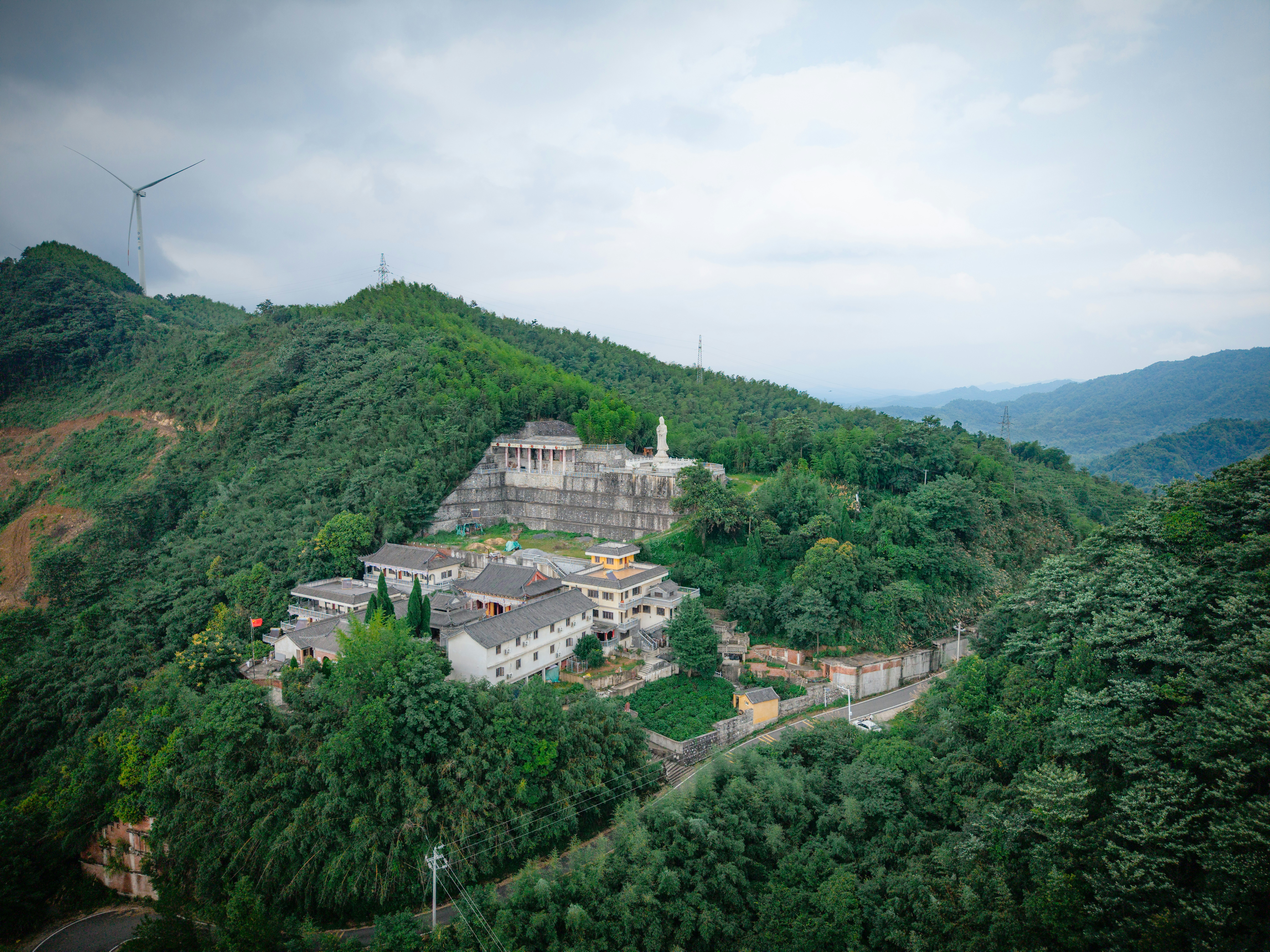 Hilltop Monastery Complex Nestled in Verdant Slopes