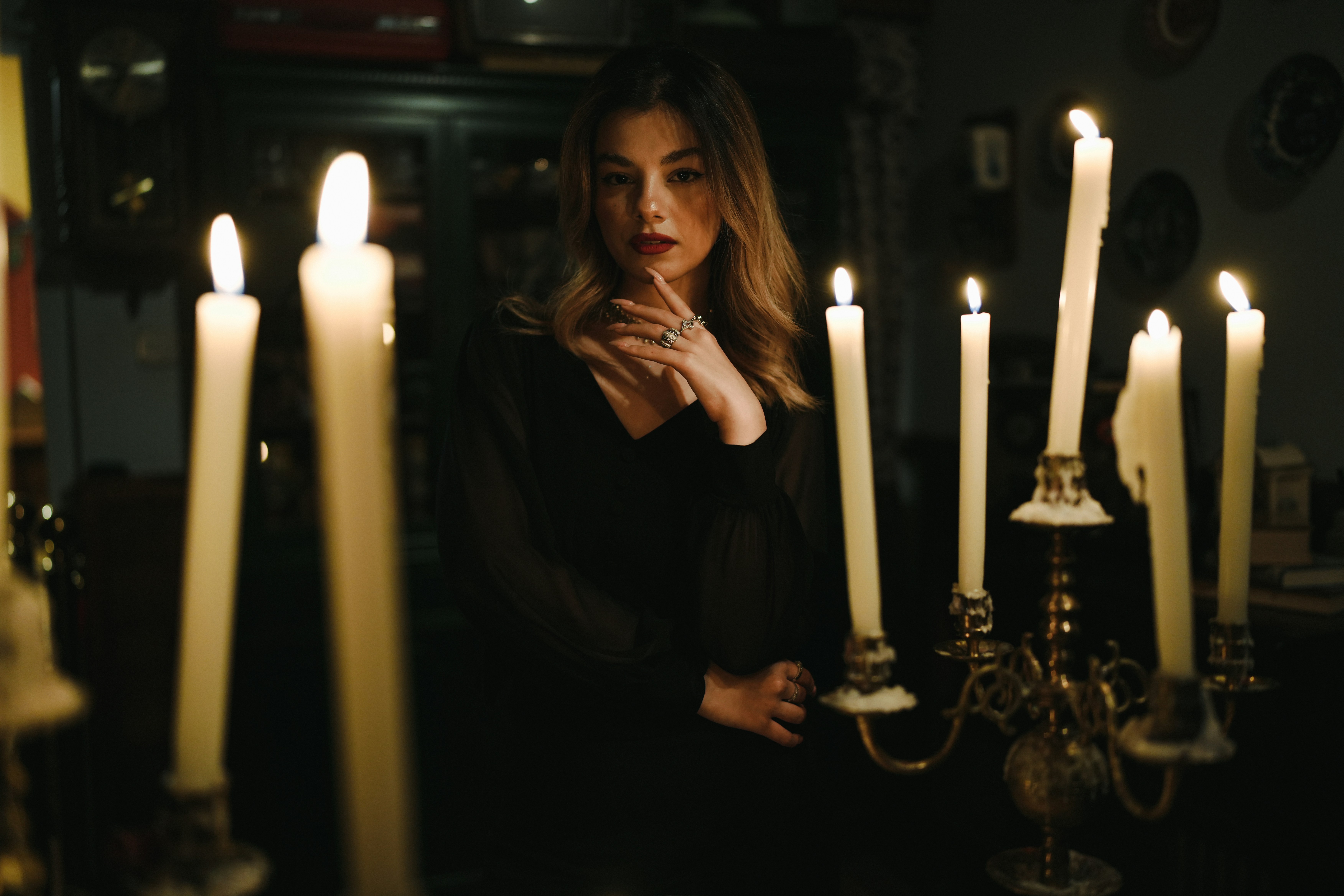 Candlelit Enigma: A Quiet Gaze in Velvet Shadows