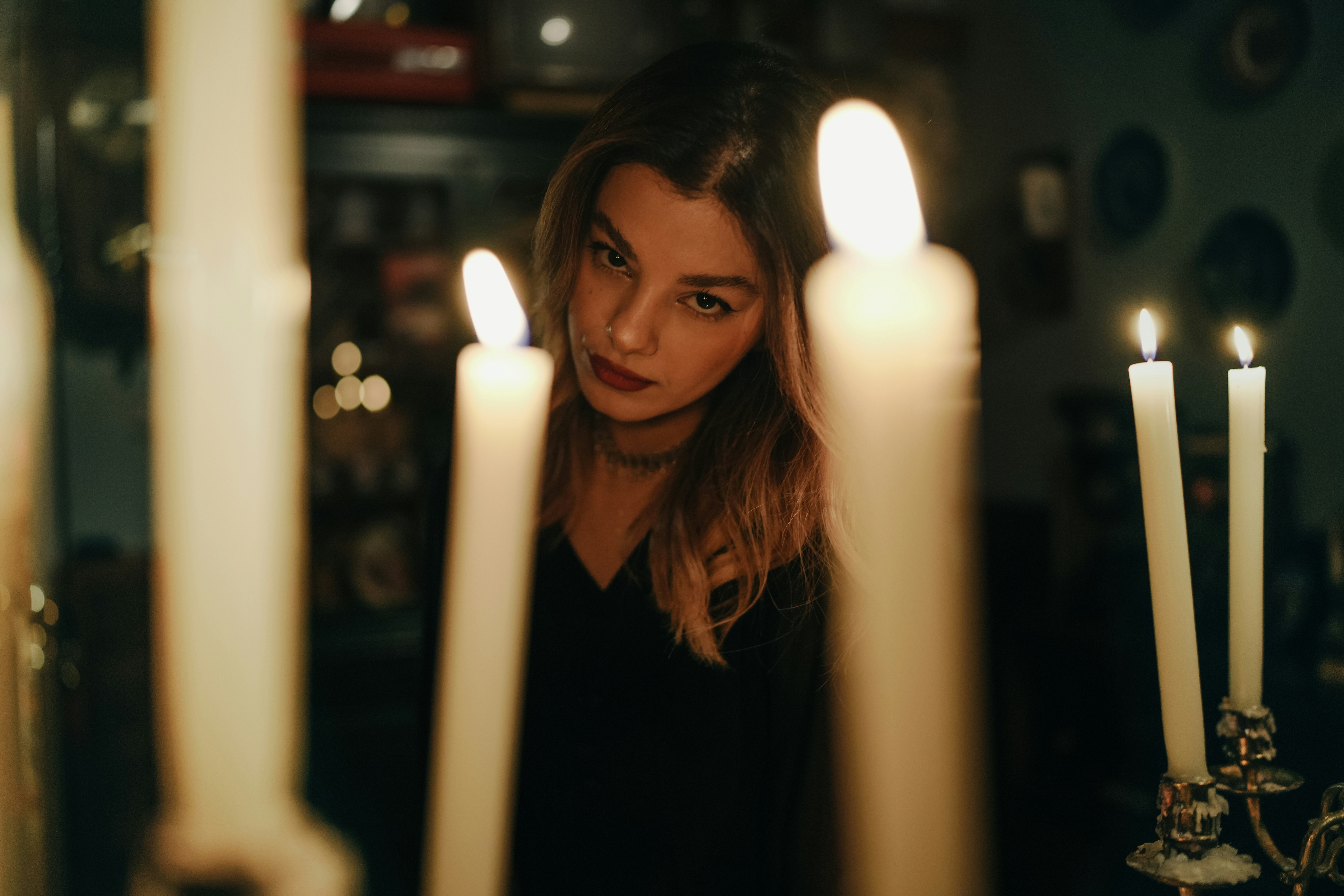 Candlelit Gaze: A Quiet Moment with Shadows and Glow