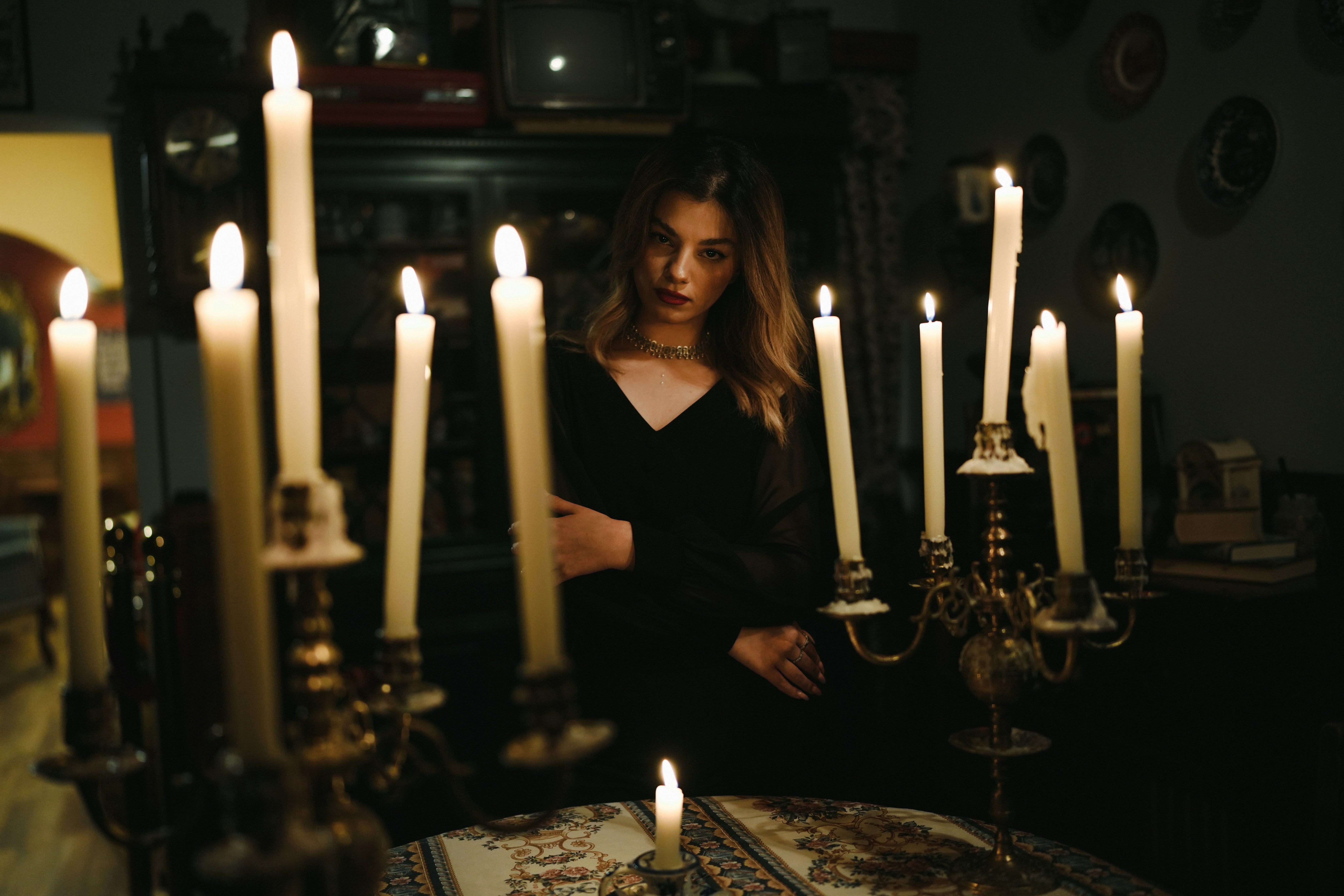 Candlelit silhouette: a contemplative portrait at the dining table