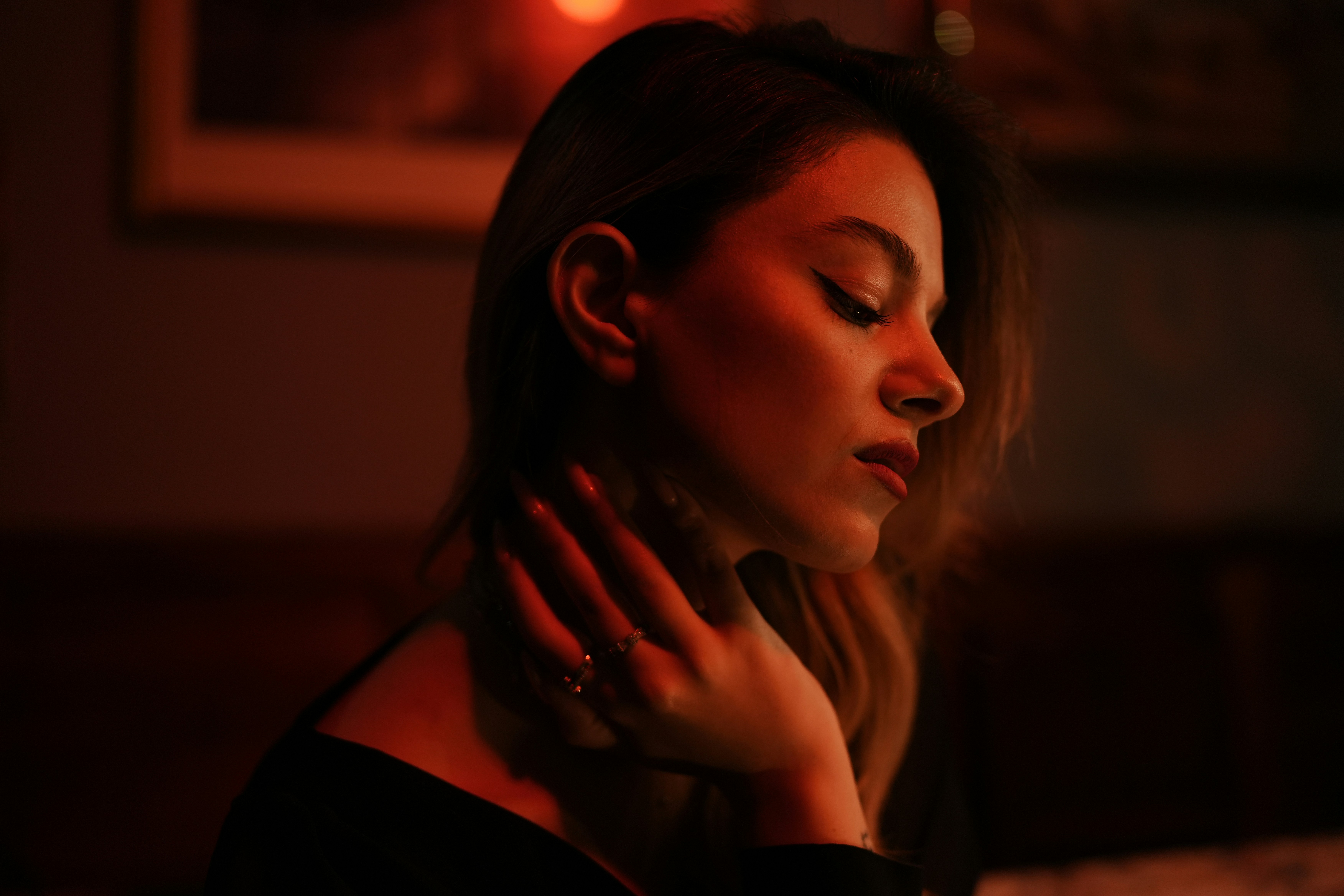 Low-Light Intimacy: Velvet Contemplation in Red