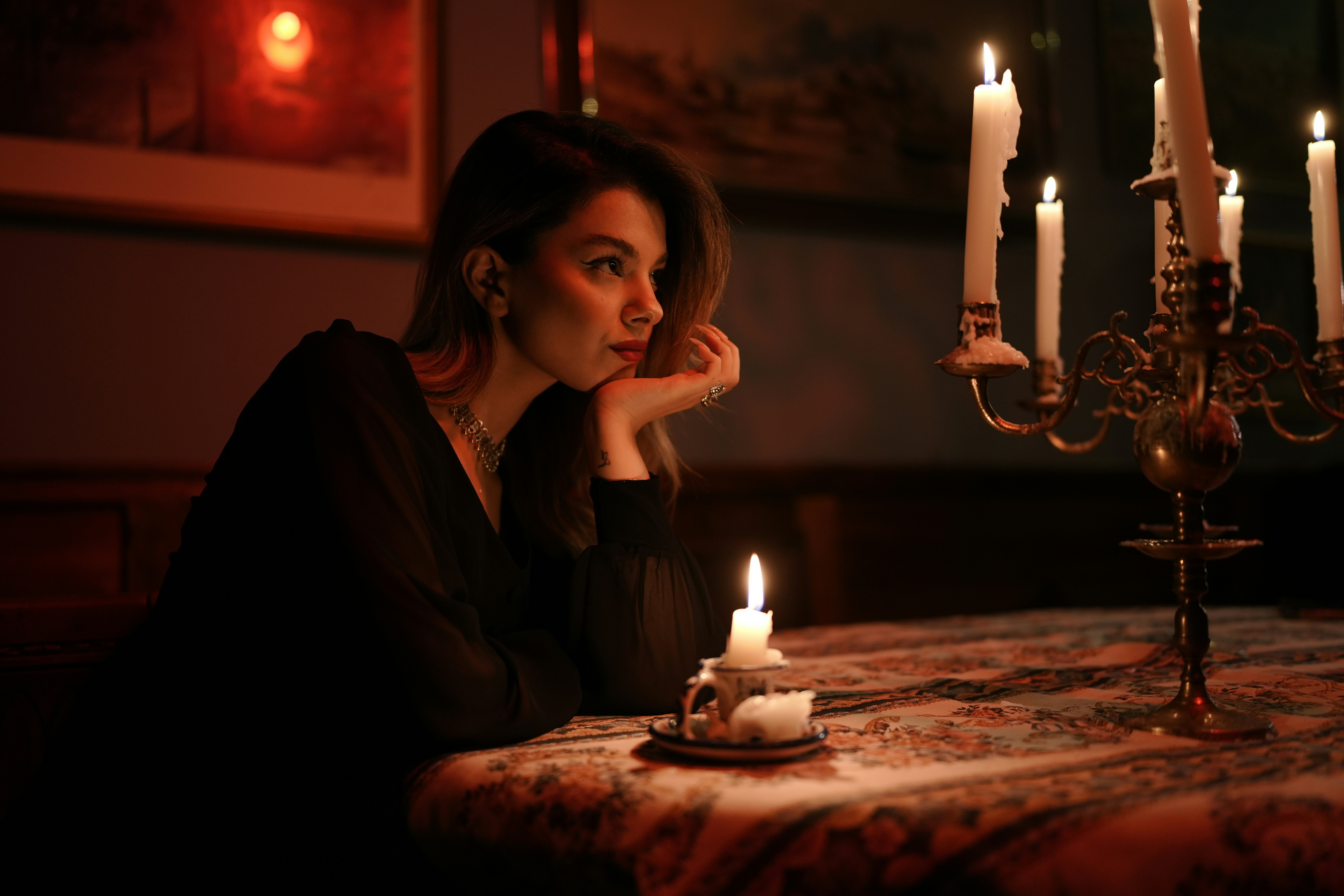 Candlelit Contemplation: A Quiet Moment at the Table
